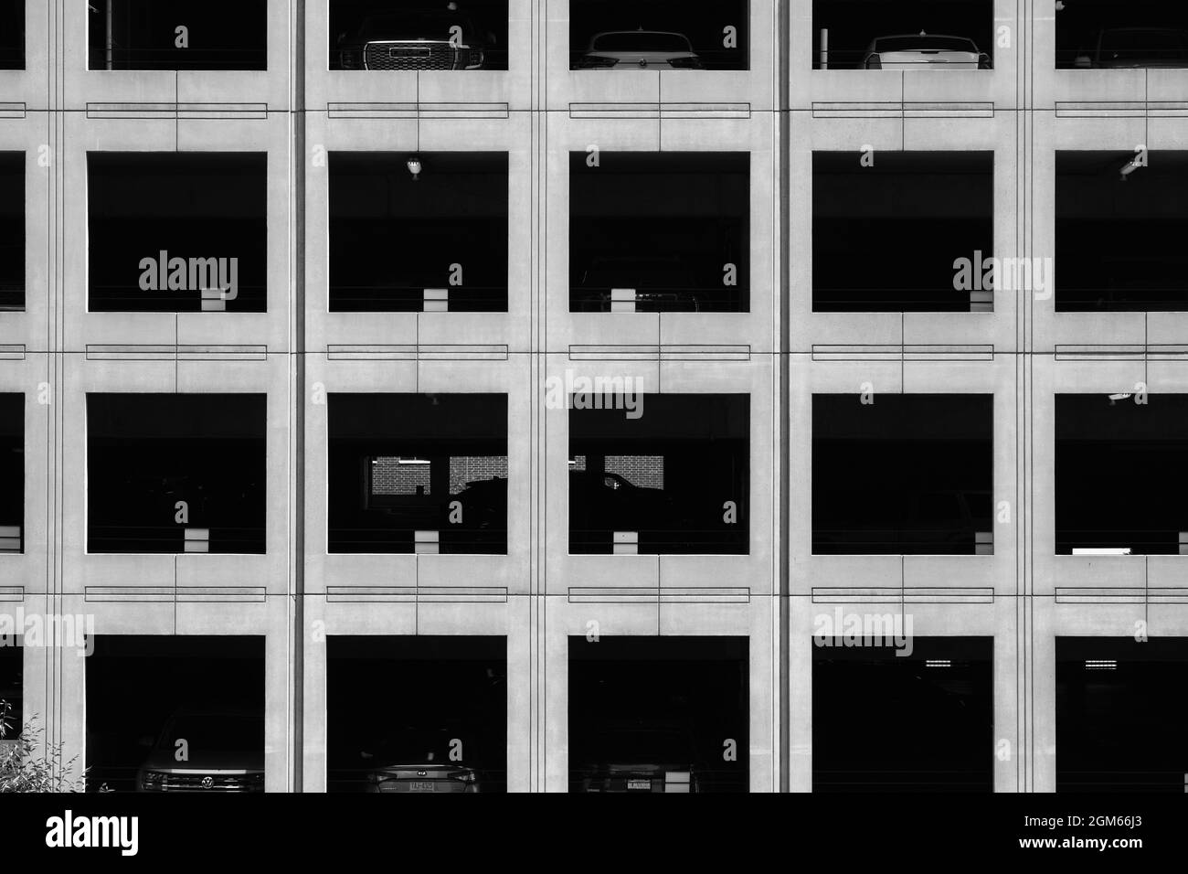 Parking garage exterior grid with abstract repeating pattern in black ...
