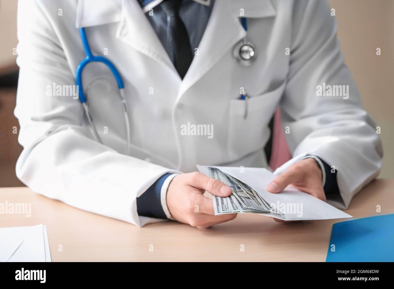 Doctor money envelope hi-res stock photography and images - Alamy