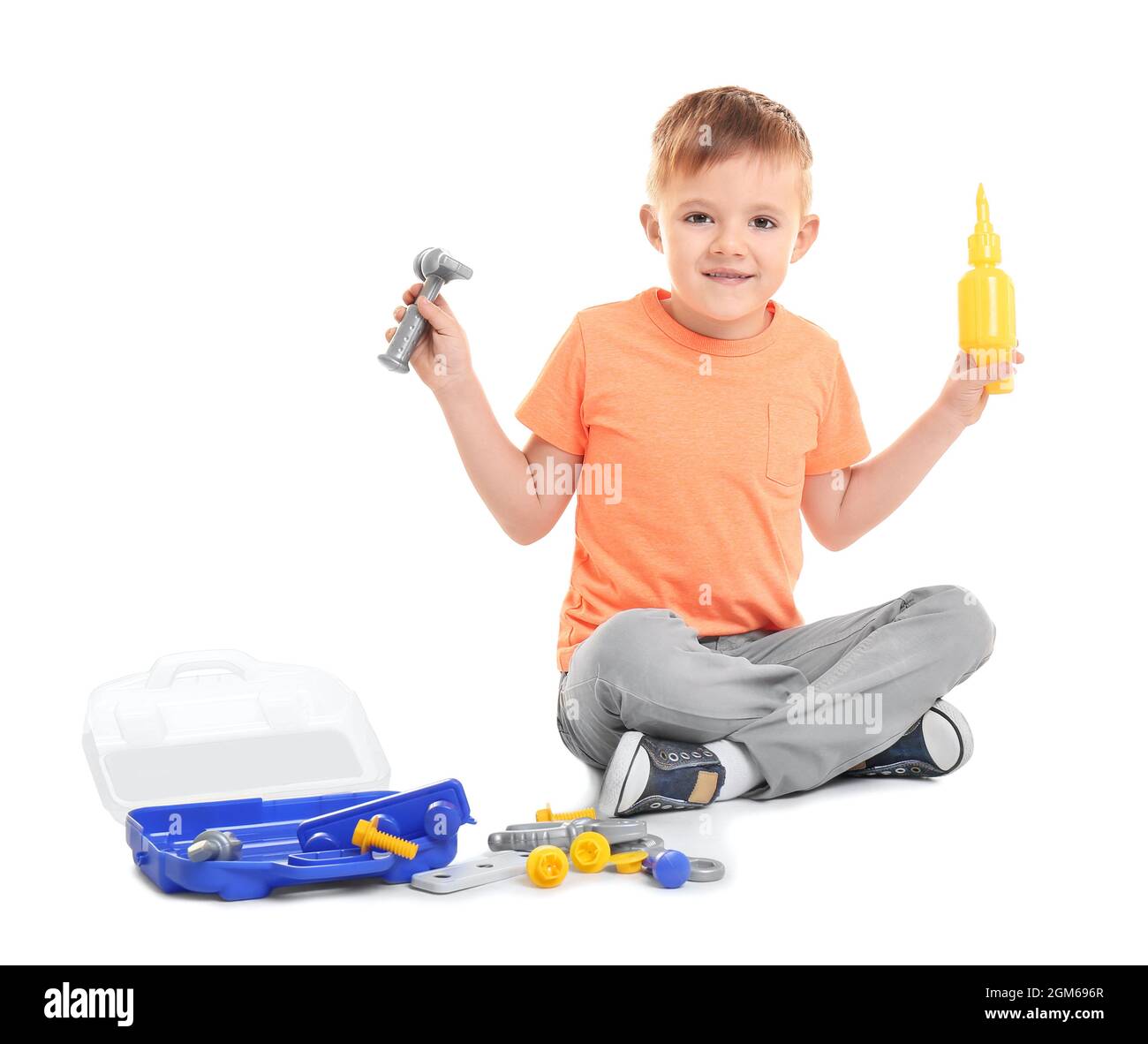 Cute little boy playing with toy tools on white background Stock Photo ...