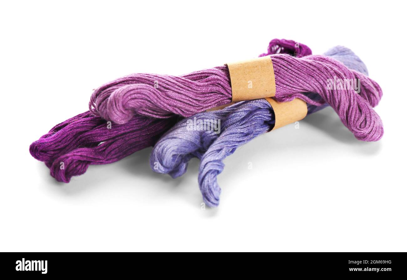 Colorful embroidery threads on white background Stock Photo - Alamy