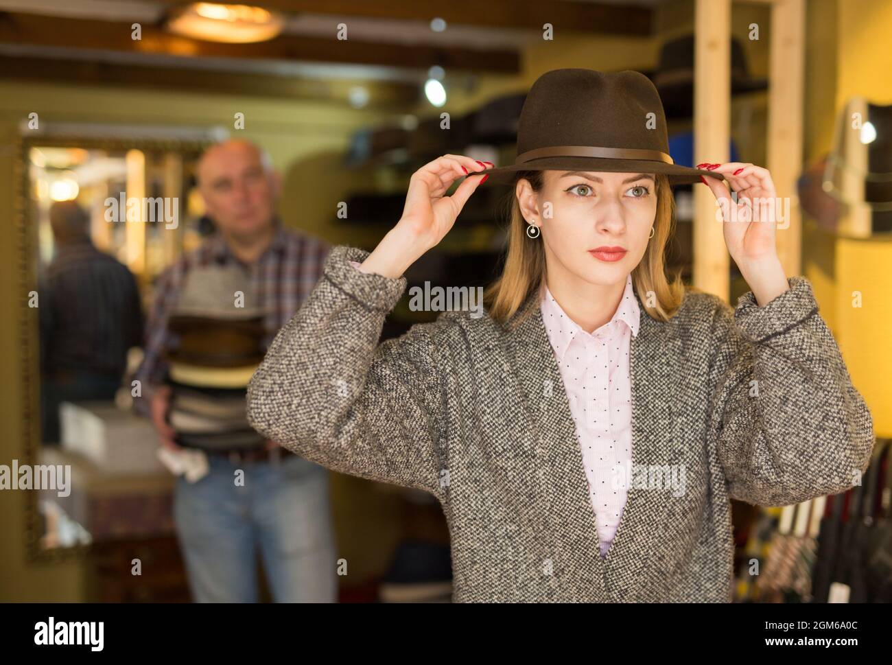 Man trying on hat shop hi-res stock photography and images - Alamy