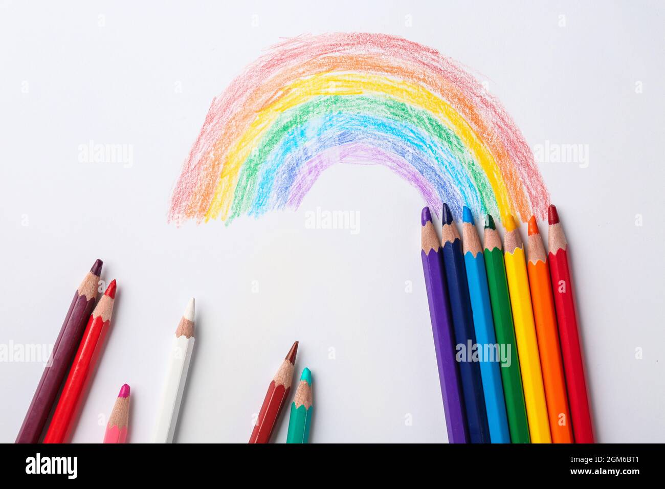 Drawing of rainbow and pencils, top view Stock Photo - Alamy