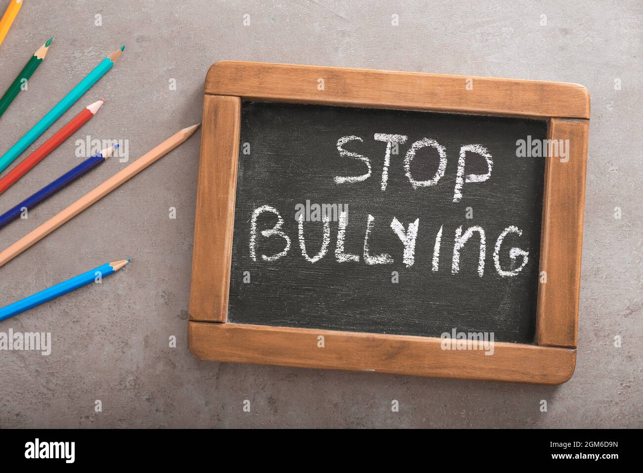 Chalkboard with text STOP BULLYING on grey background Stock Photo - Alamy