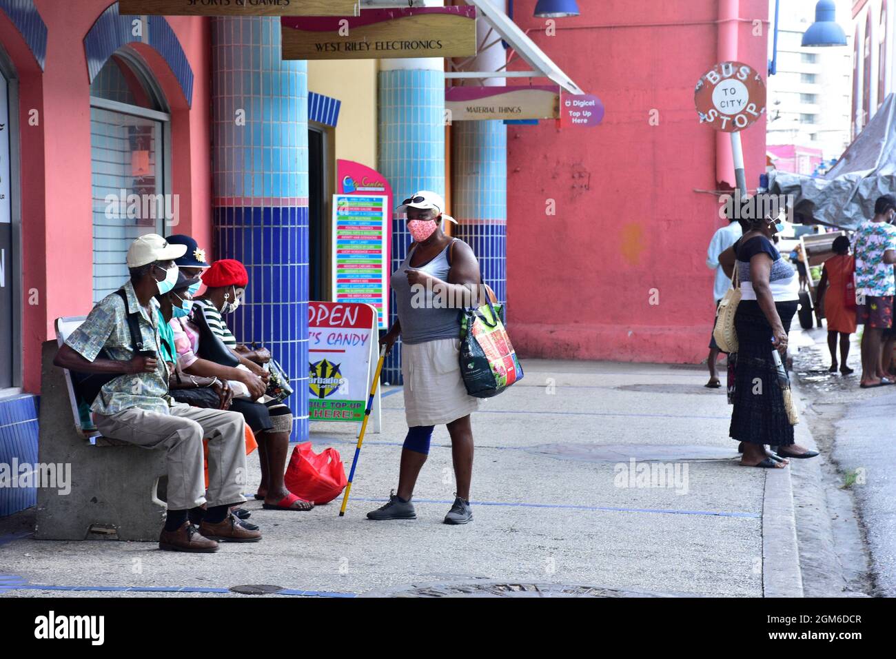 Passengers waiting for bus at Bus Stop in Bridgetown Barbados Stock ...