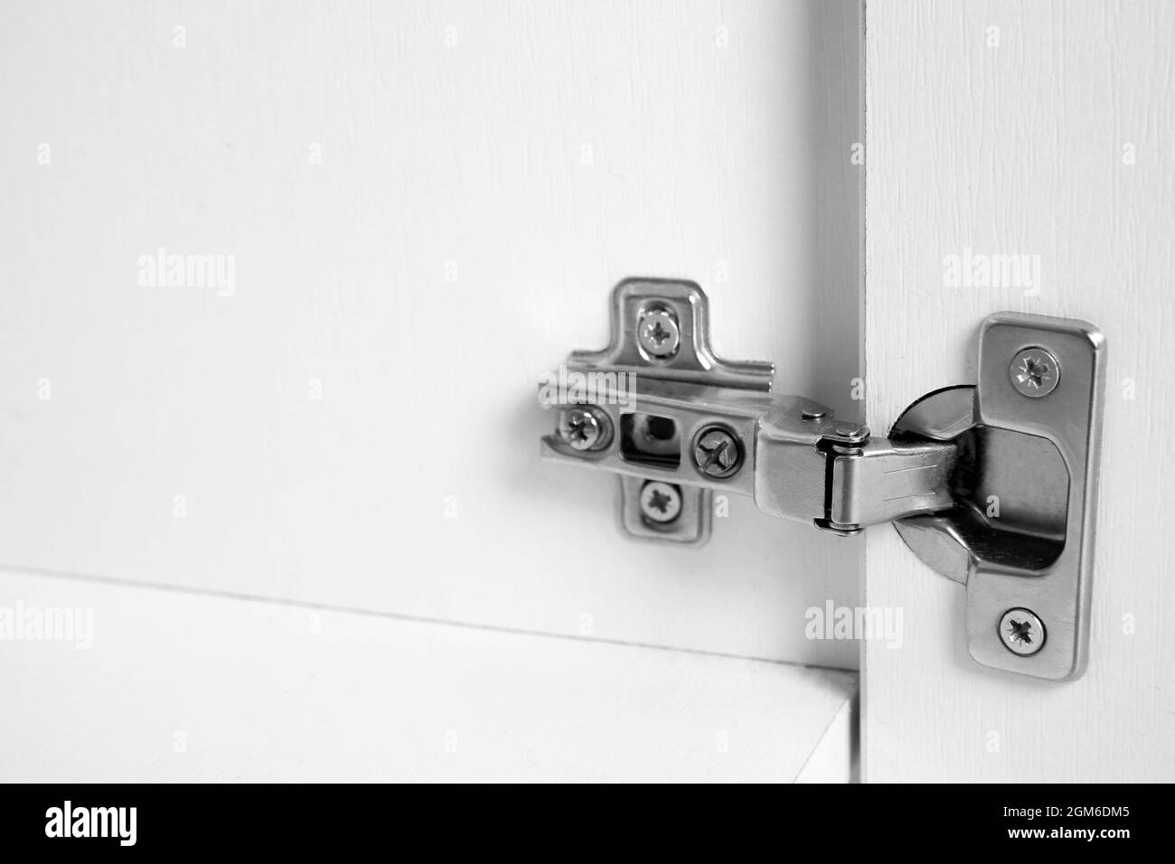 Metal hinges of wardrobe, closeup Stock Photo - Alamy