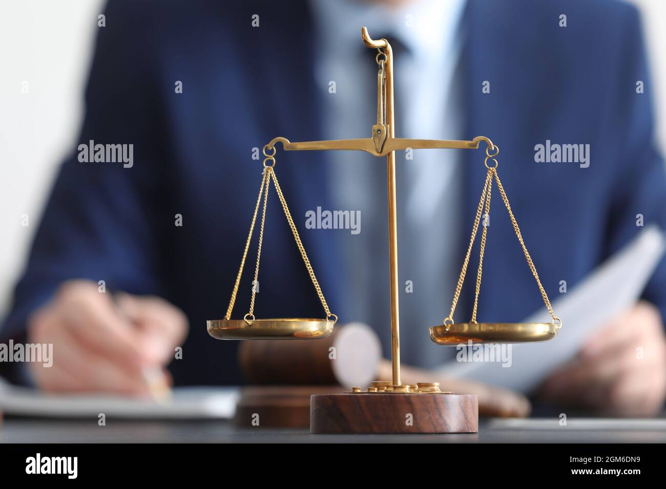 Scales of justice on table in notary's office Stock Photo - Alamy