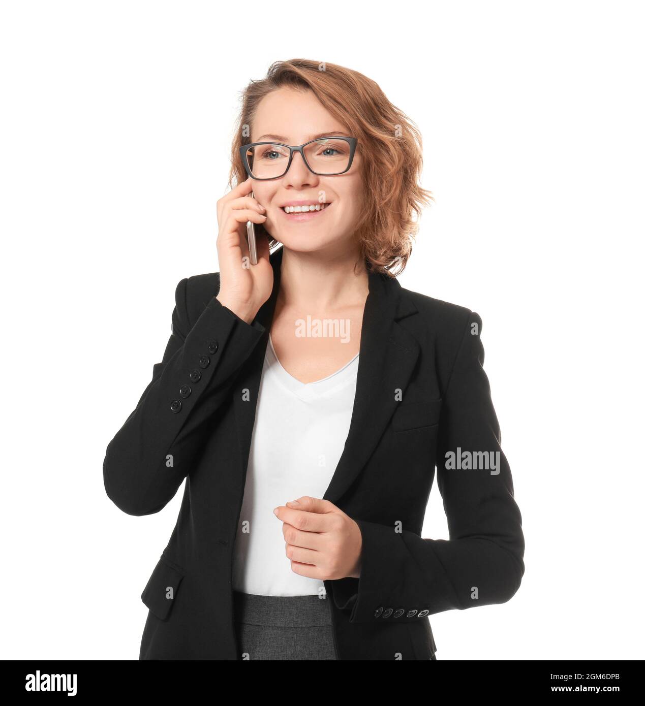 Beautiful real estate agent talking on phone against white background ...