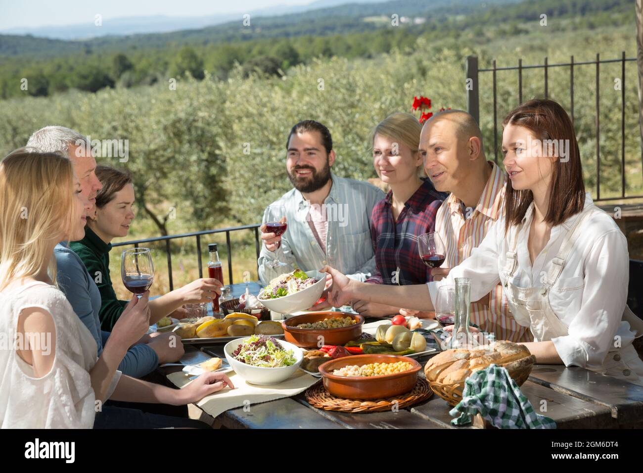 Friends chatting table on terrace hi-res stock photography and images ...