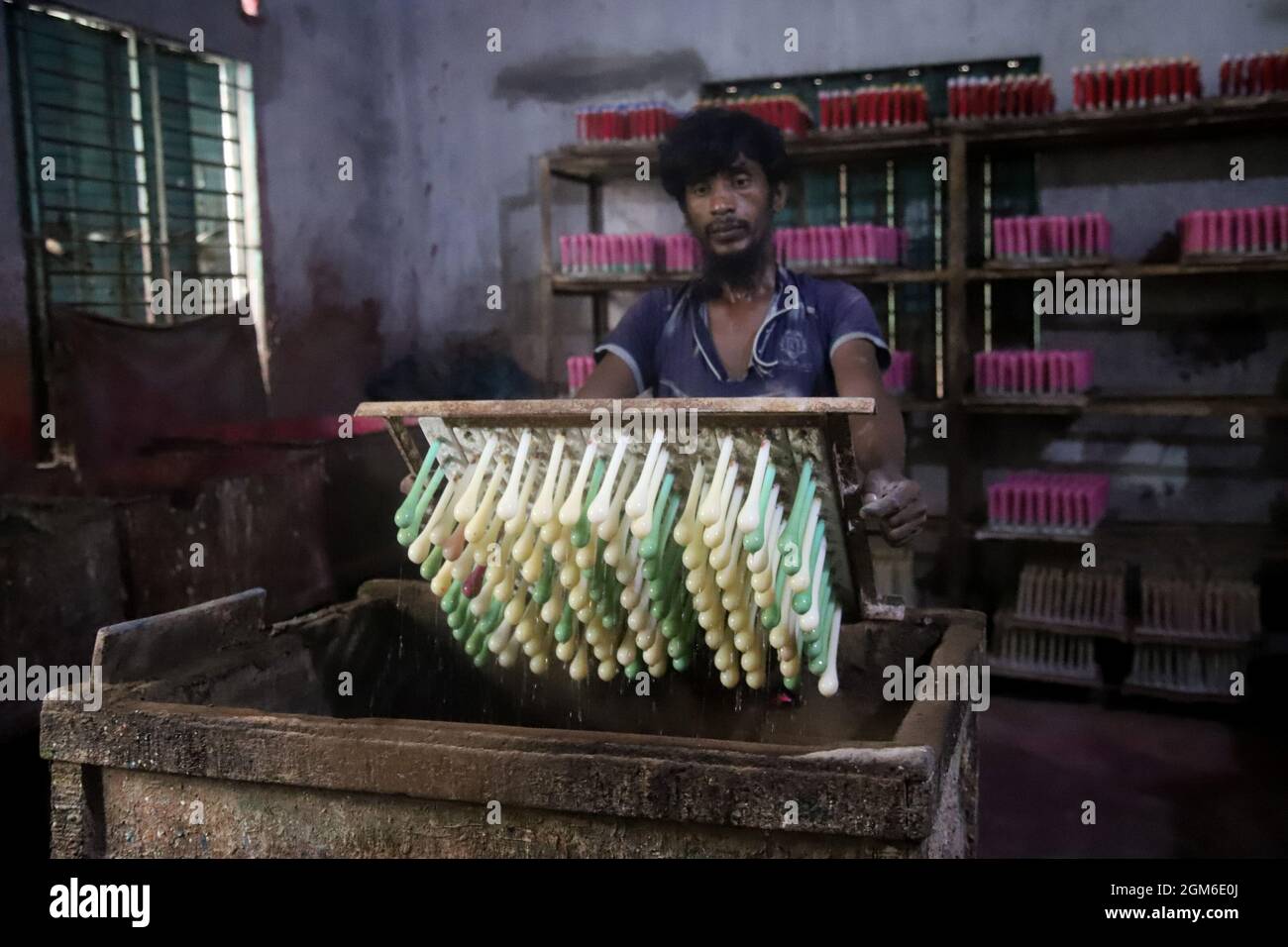Non Exclusive: An employee works sorting balloons in a balloon factory ...