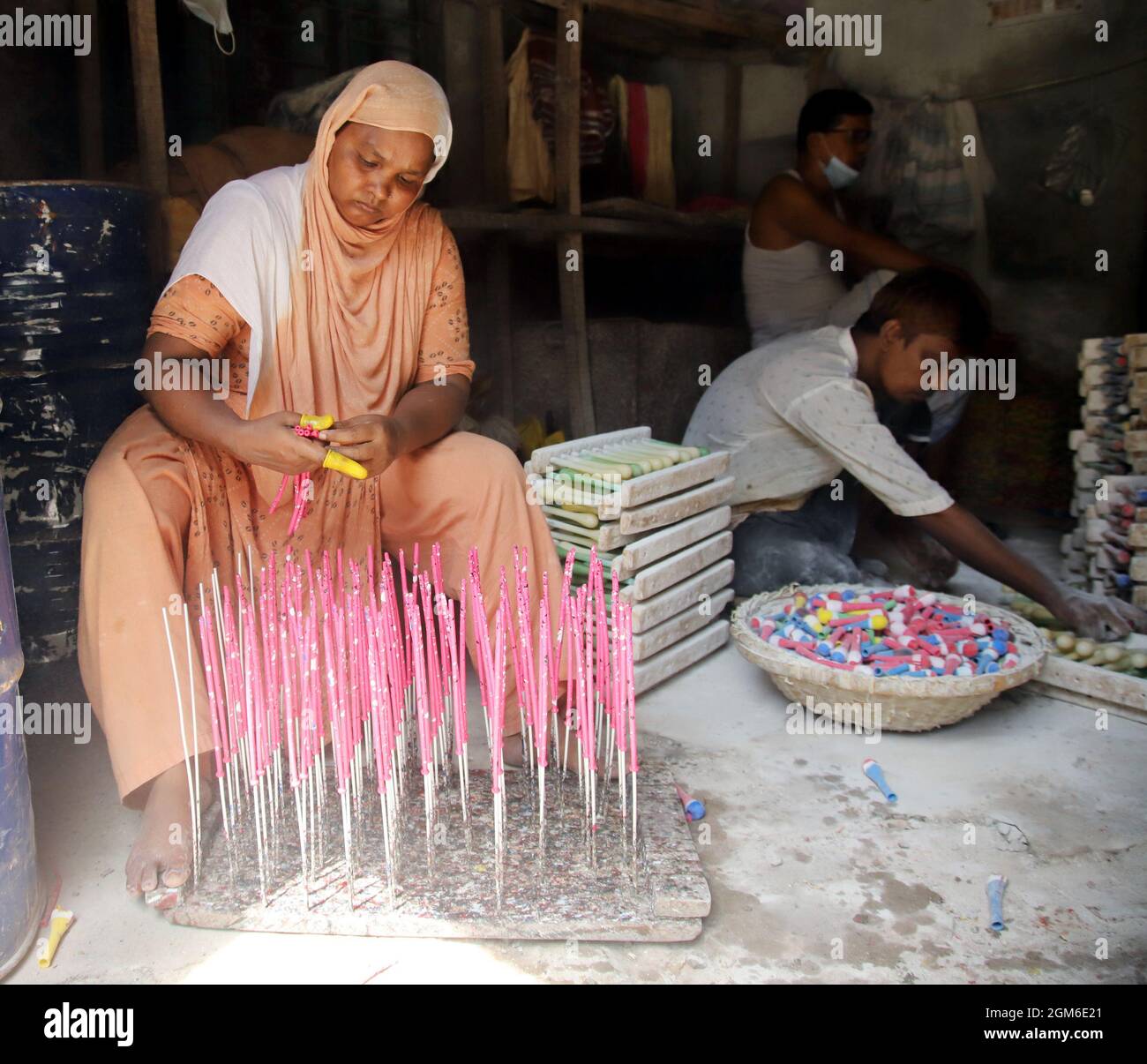 Non Exclusive: An employee works sorting balloons in a balloon factory ...
