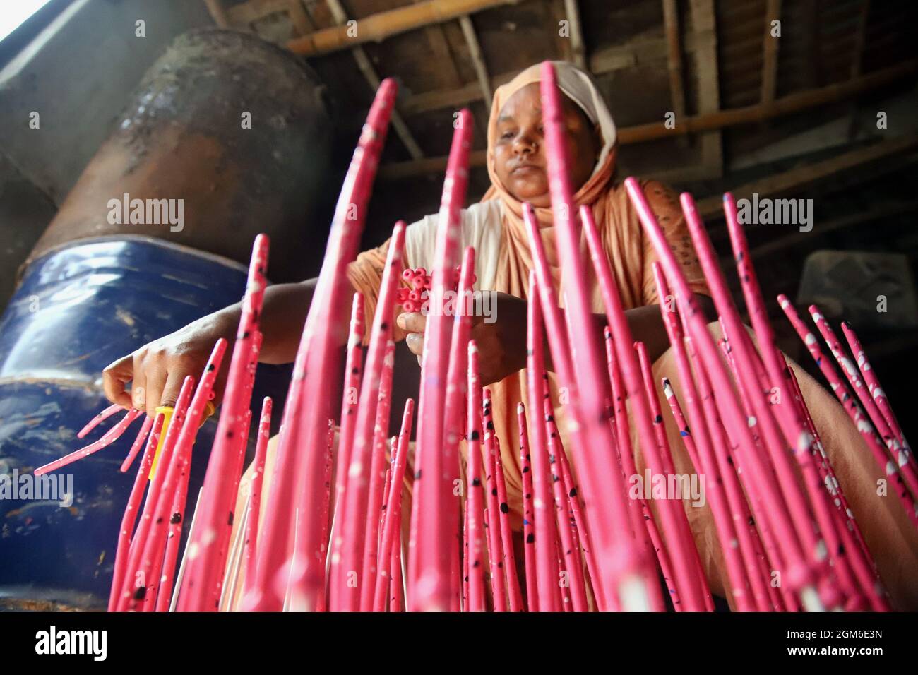 Non Exclusive: An employee works sorting balloons in a balloon factory ...