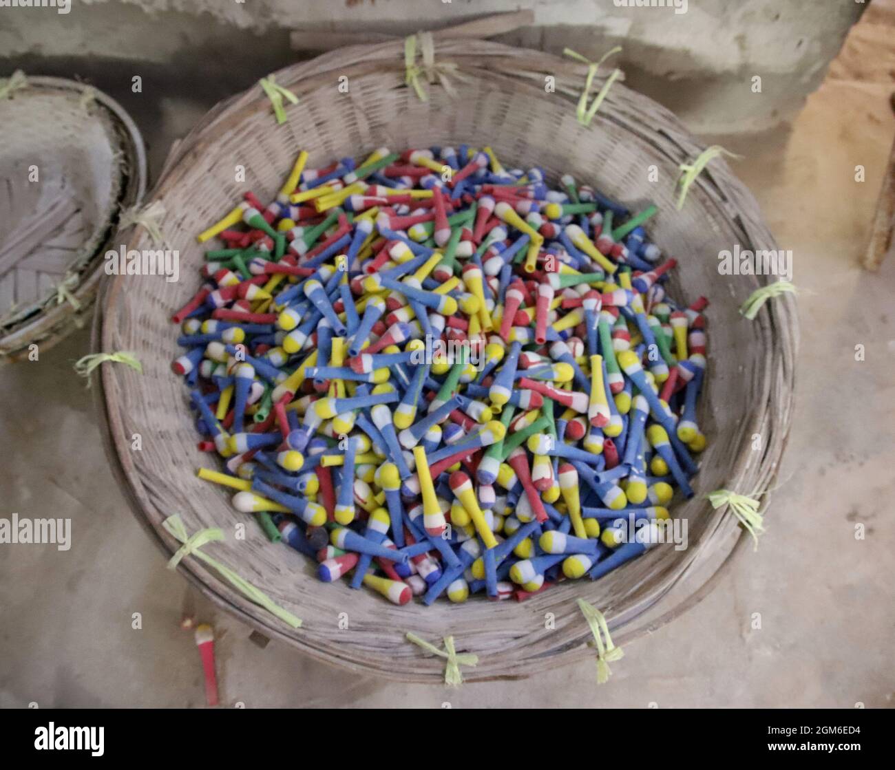 Non Exclusive: An employee works sorting balloons in a balloon factory ...