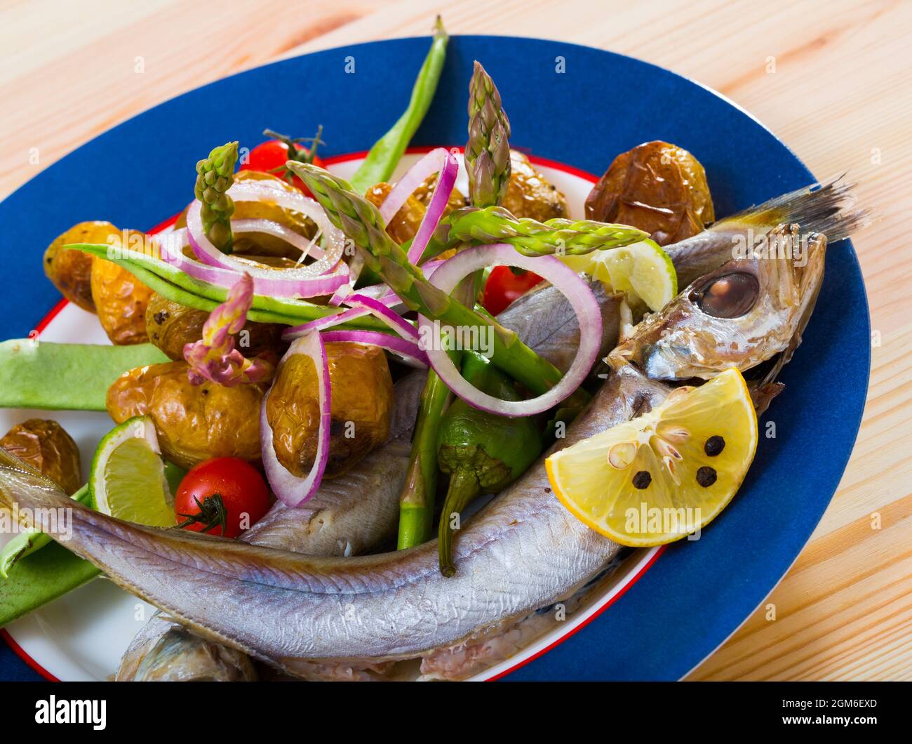 Stewed Blue Whiting fish with potatoes Stock Photo - Alamy