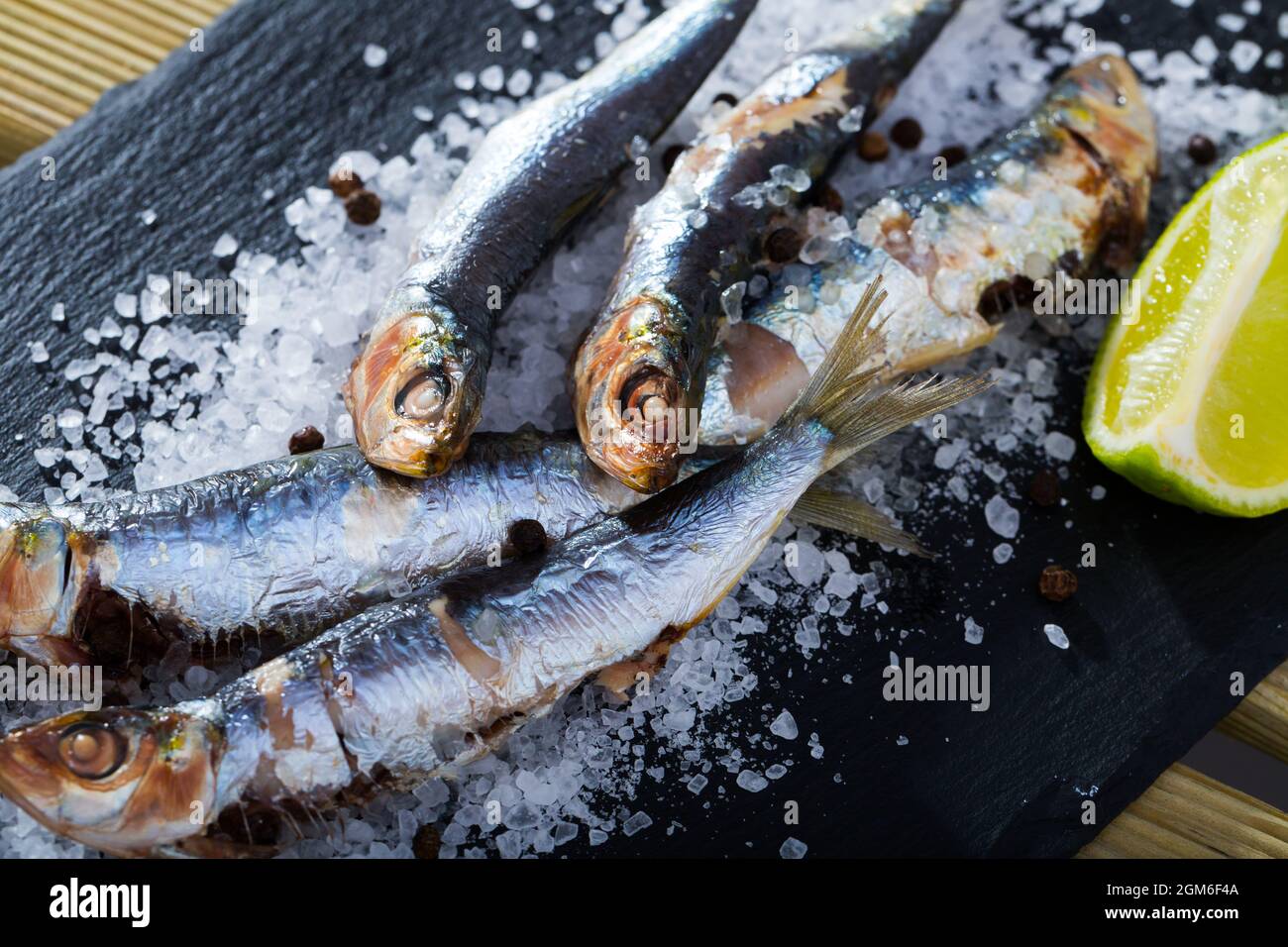Baked pilchards on sea salt Stock Photo - Alamy
