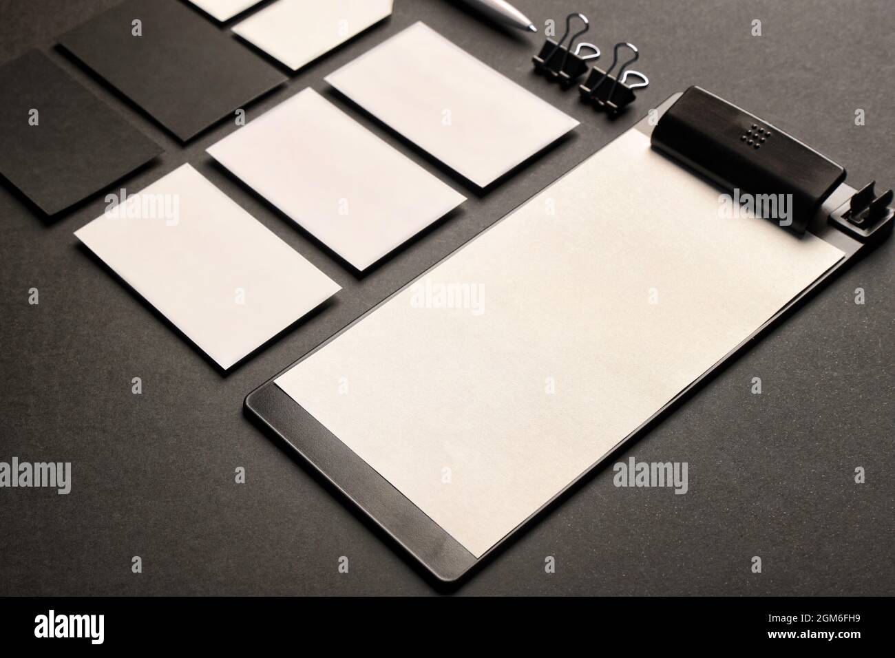 Blank items as mockups for branding on dark background Stock Photo - Alamy