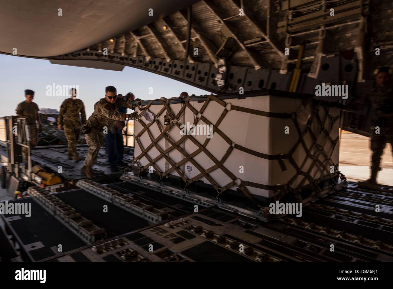 U.S. Airmen from the 60th Aerial Port Squadron and 8th Airlift Squadron ...