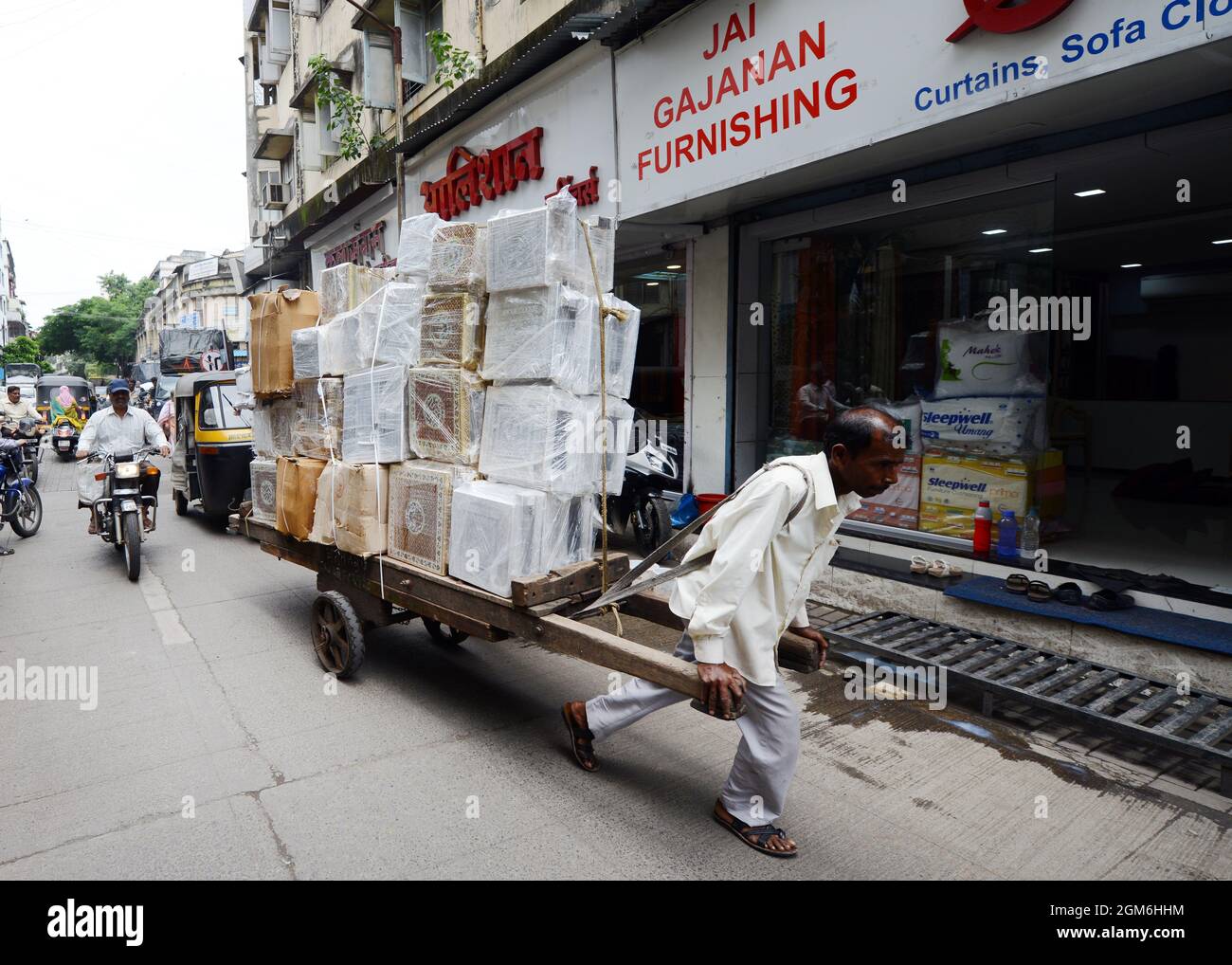 Man pulling cart hi-res stock photography and images - Alamy
