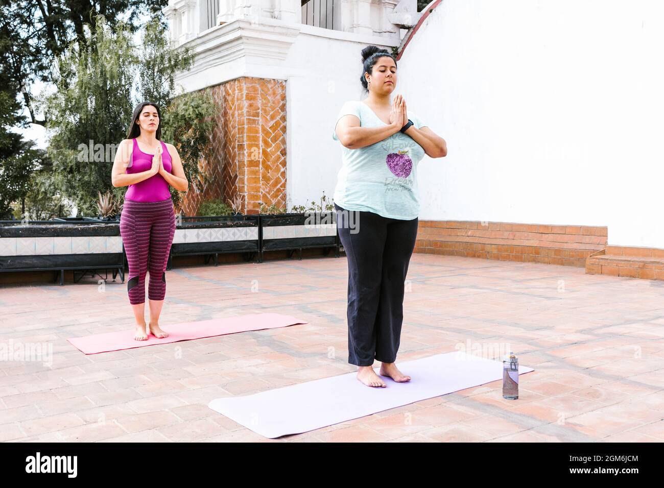 Plus Size Latin Girl Meditating With Closed Eyes Standing In Outdoor