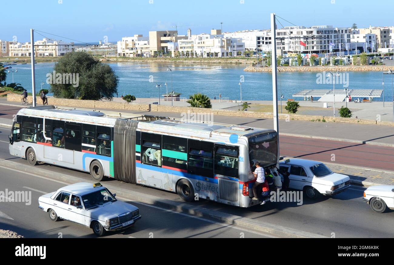 Catching a ride on the back of a public bus in Rabat, Morocco Stock ...