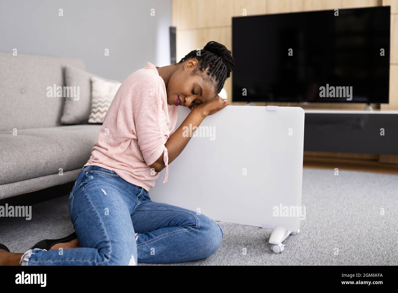Happy Warm Woman Near Radiator With Heat Comfort Stock Photo - Alamy
