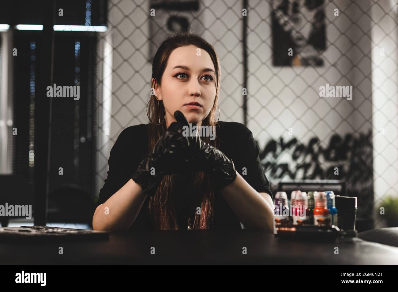 Portrait of professional female tattooist in tattoo studio Stock Photo ...