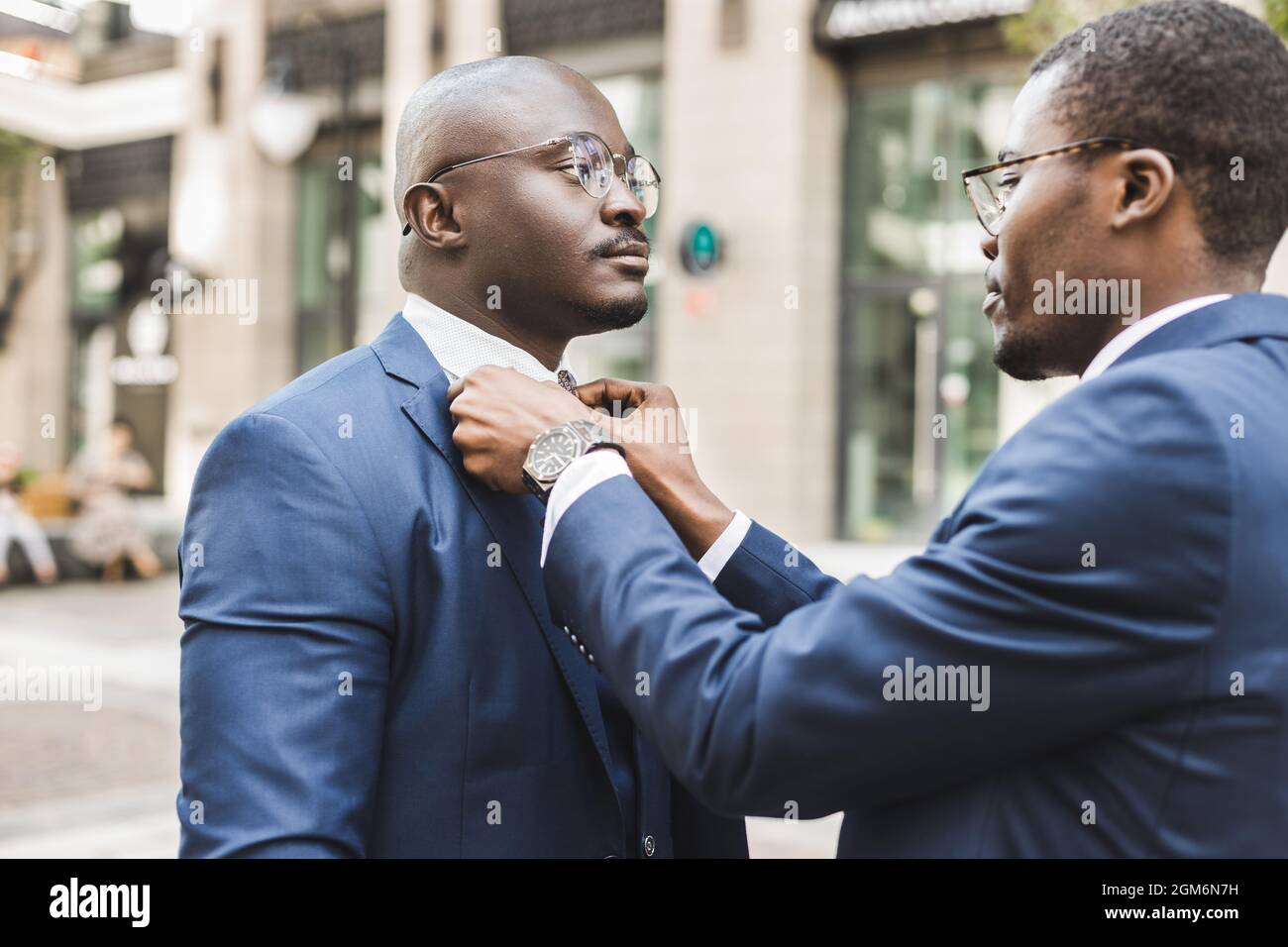 Two black African American businessman friends before an important ...
