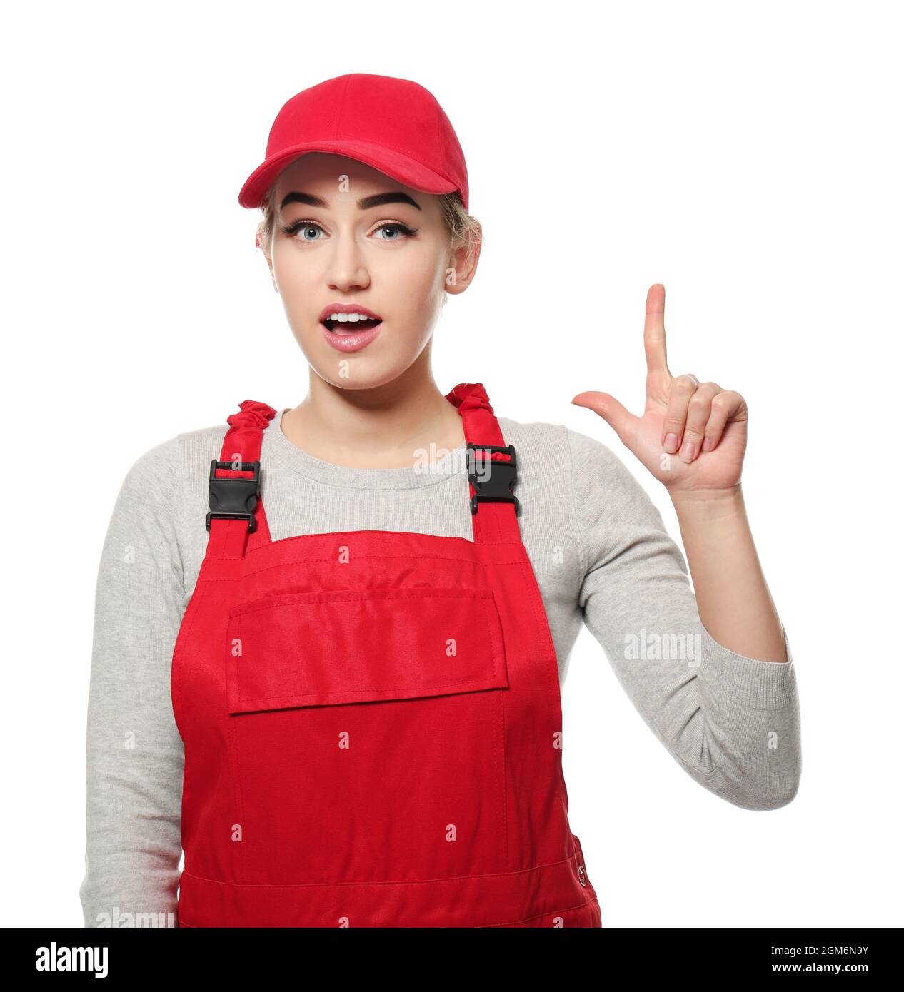 Female auto mechanic with raised index finger on white background Stock ...