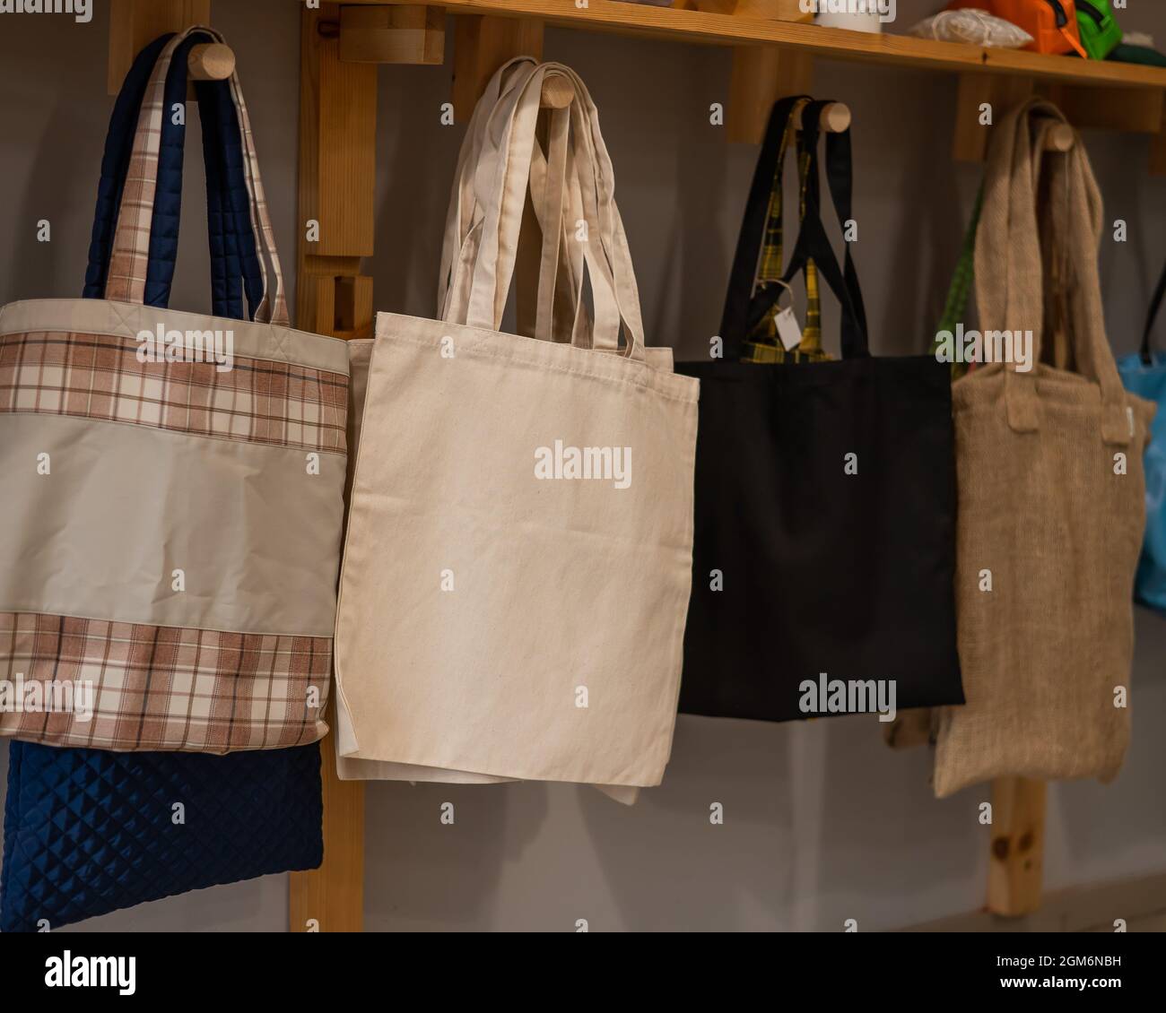 Choosing cotton bags in an eco-friendly store Stock Photo - Alamy
