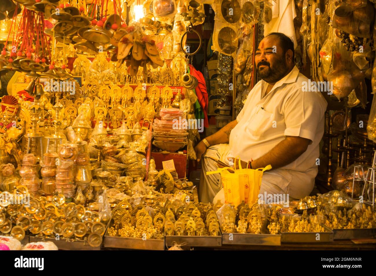 A shopkeeper selling puja items outside the famous and beautiful ...