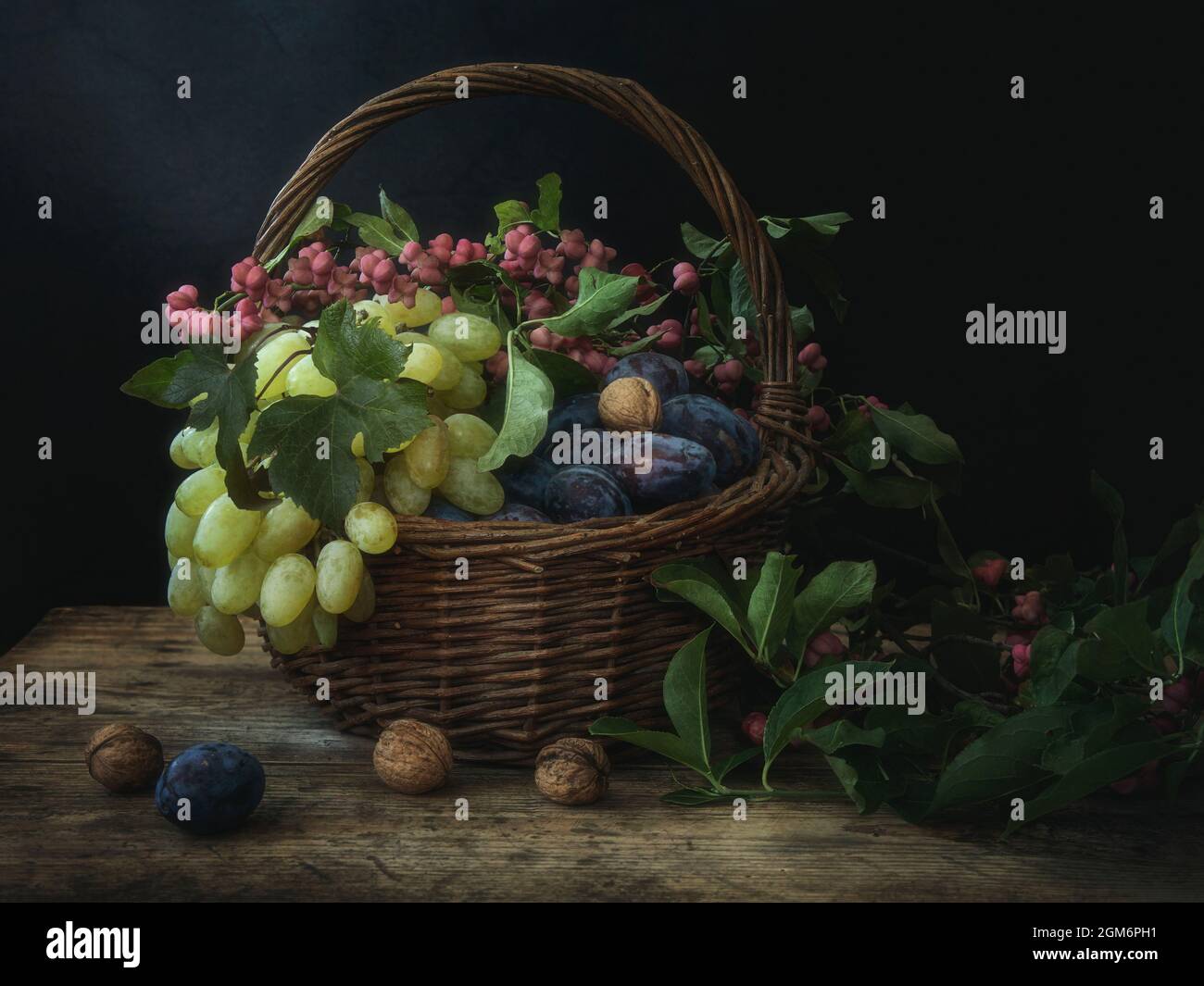 Still life with basket of fruits Stock Photo - Alamy