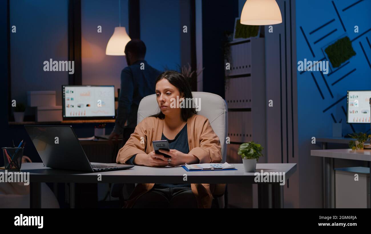 Businesswoman working in start-up business company office sitting at ...