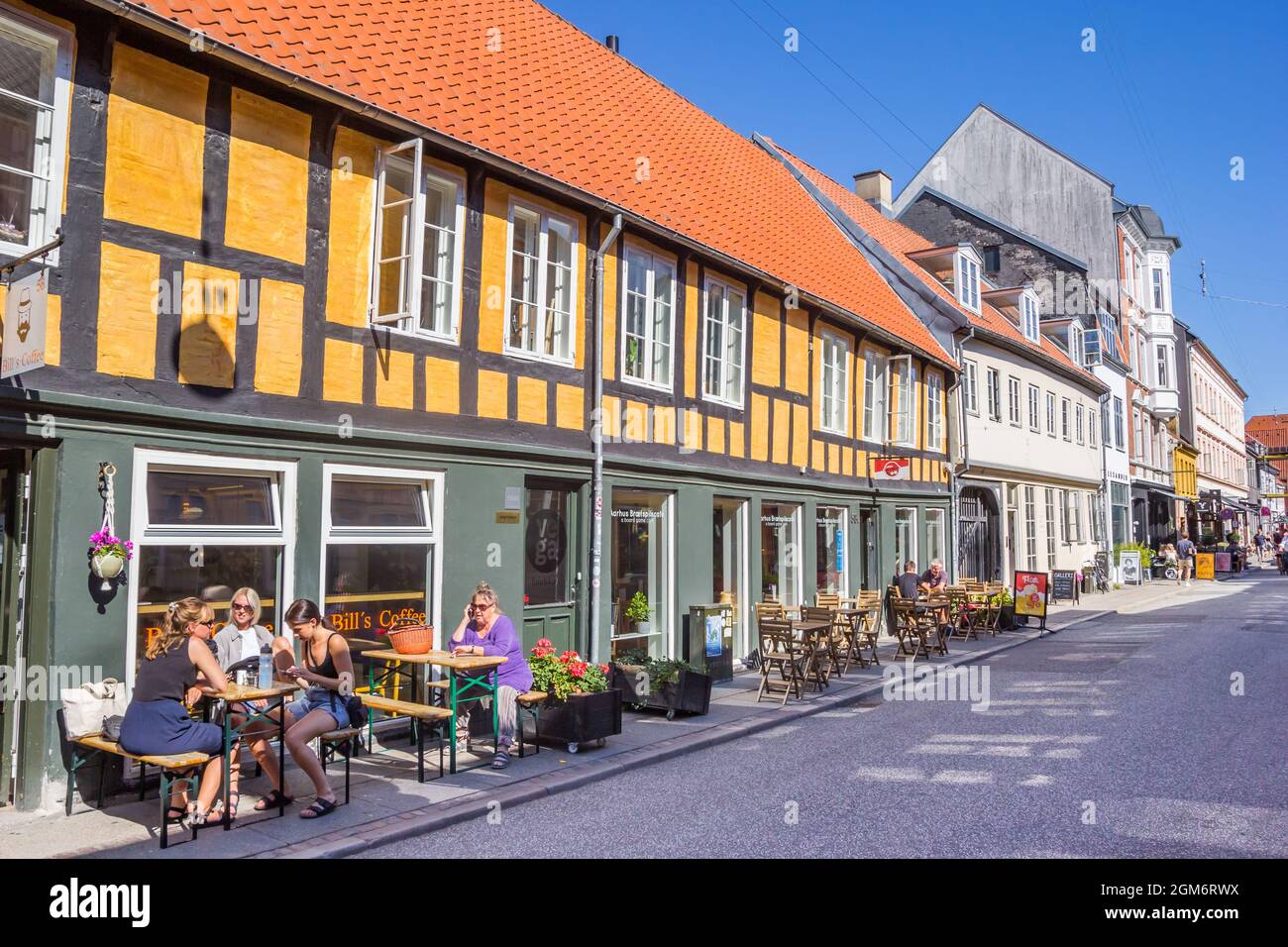 People sitting and drinking outside a restaurant in Aarhus, Denmark ...