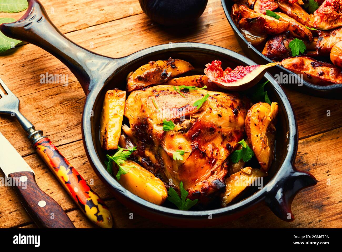 Homemade chicken roasted with potatoes and figs.Meat fried with figs in ...
