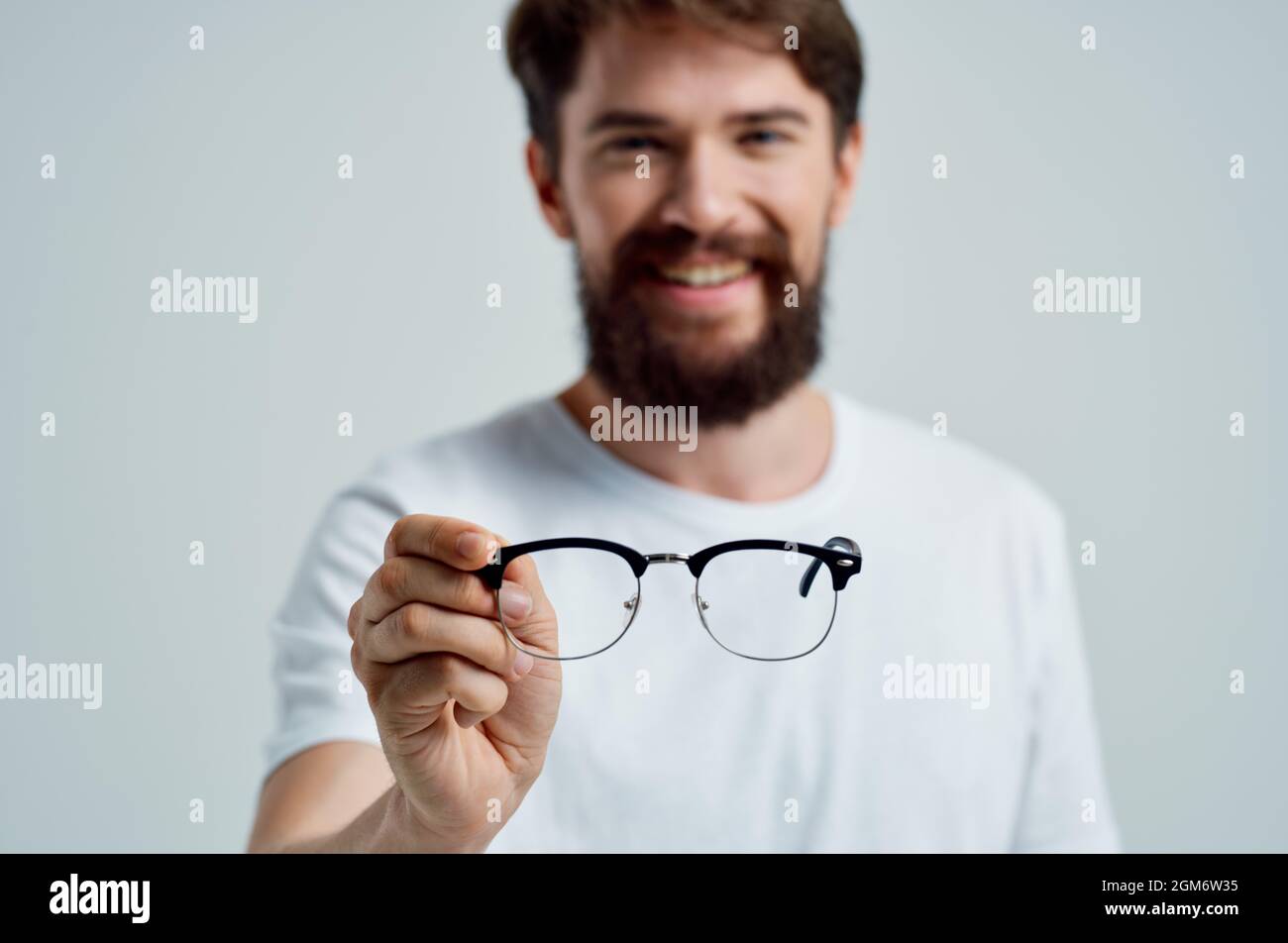 sick man with glasses in hand vision problems isolated background Stock ...
