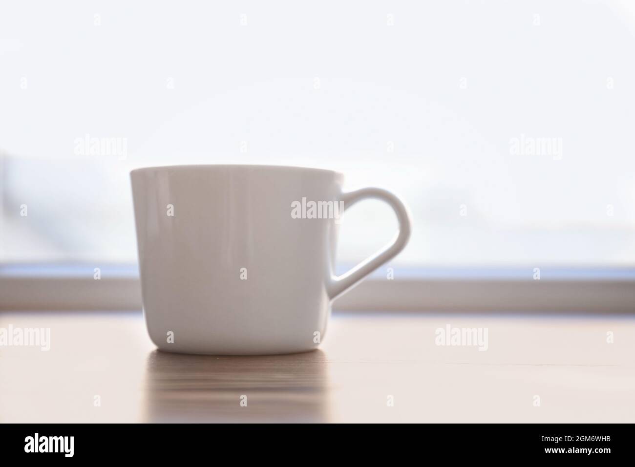 Ceramic cup on window sill Stock Photo - Alamy