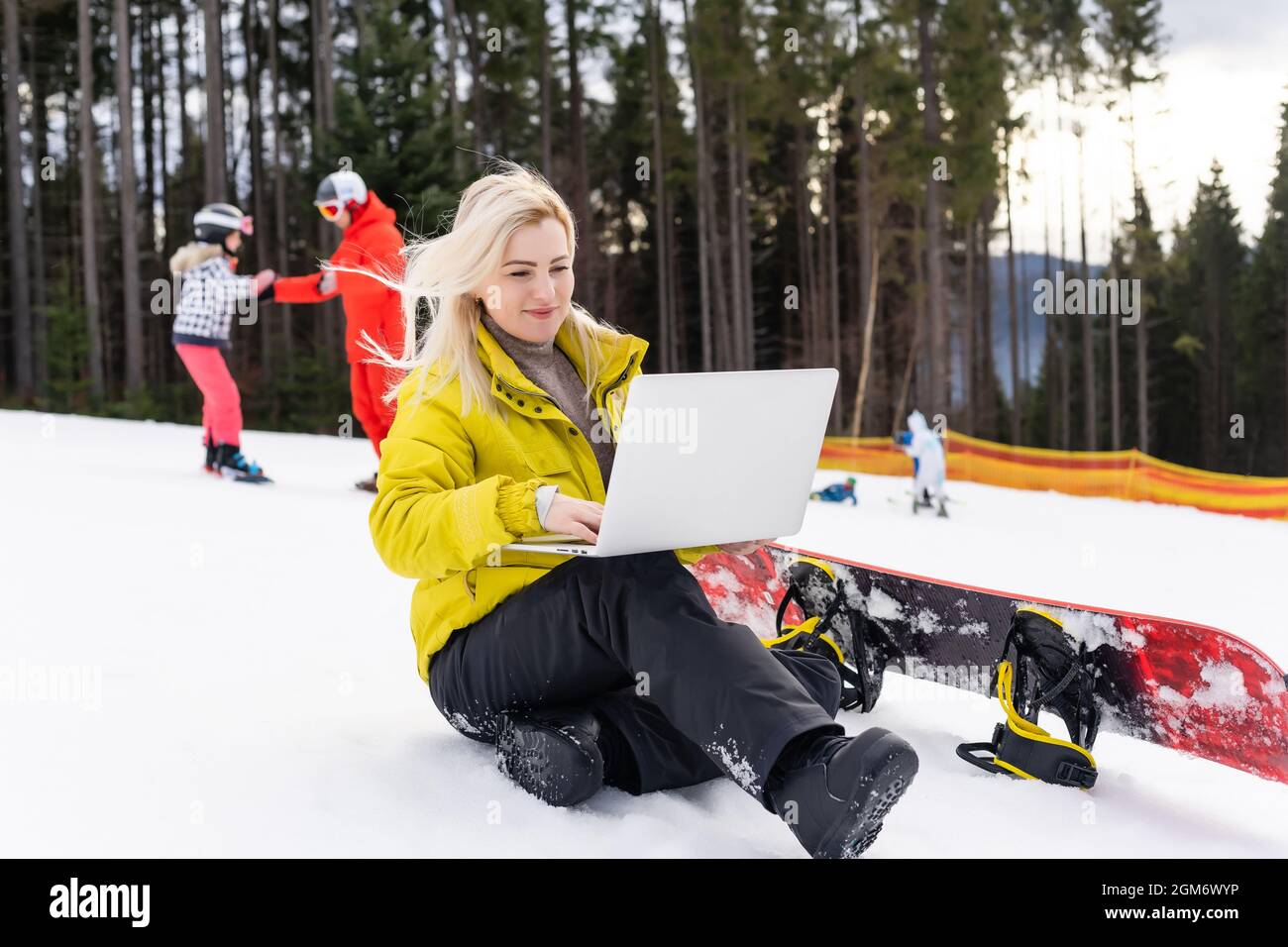 woman snowboarder working laptop in winter mountains Stock Photo - Alamy