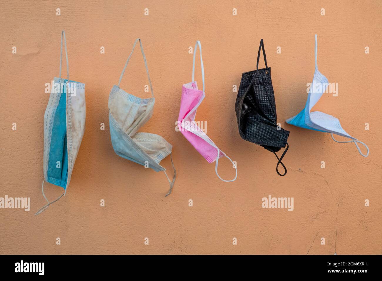 COVID-19 Waste Pollution crisis. Used discarded disposable face masks ...