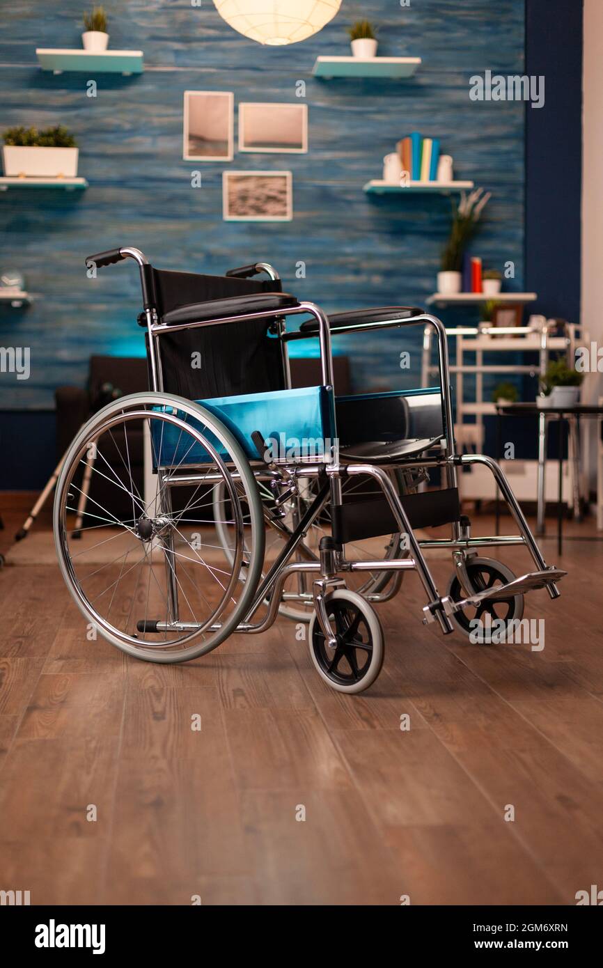 Empty living room in apartment with wheelchair on floor for disabled ...