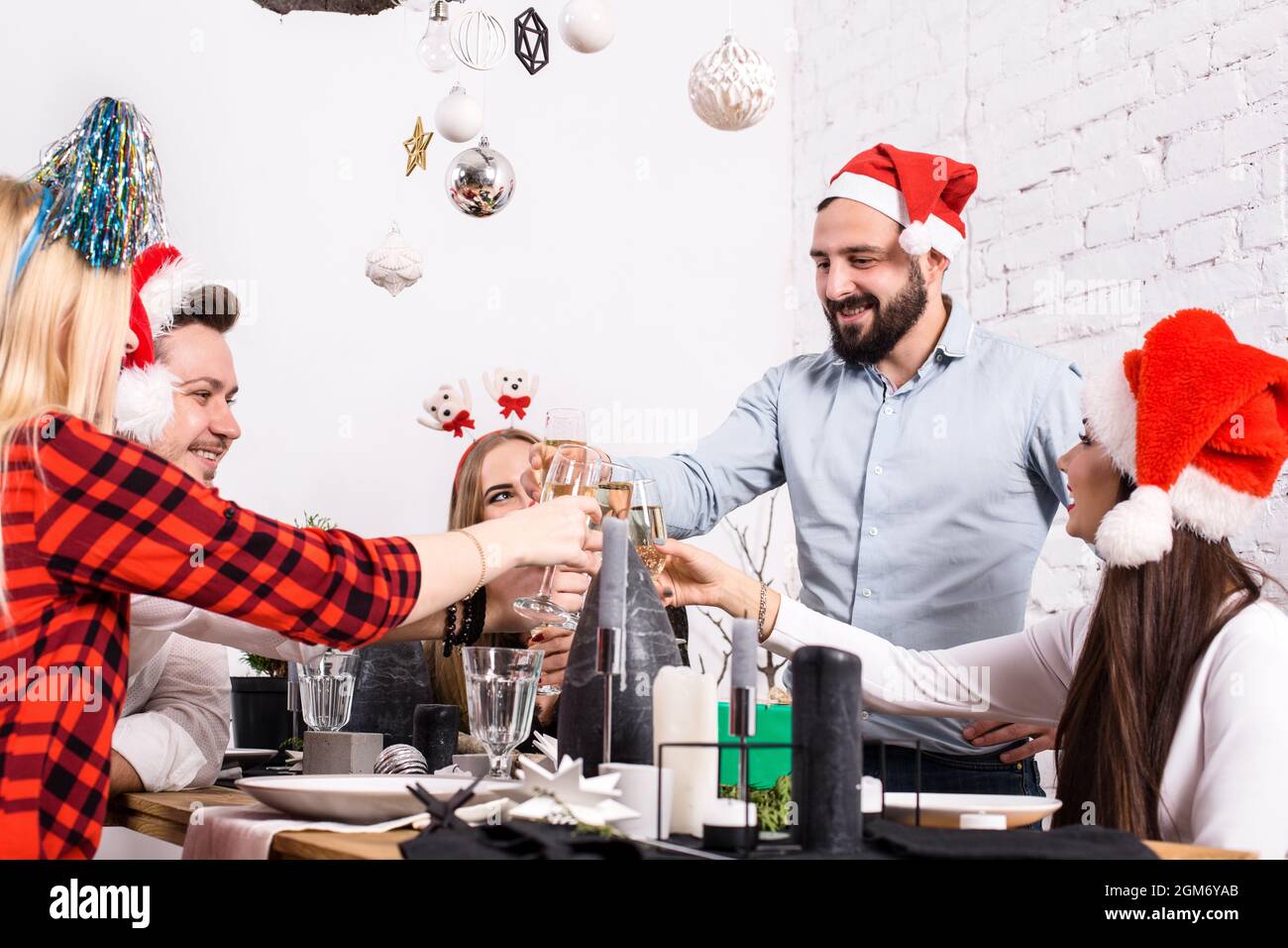 Christmas party cheerful friends at having drink and fun Stock Photo ...