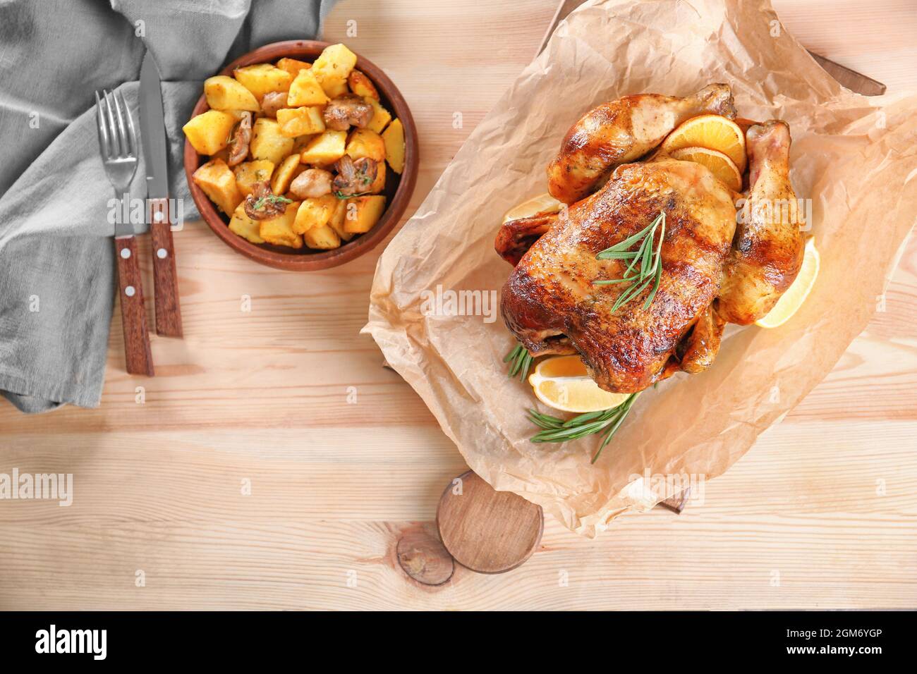 Delicious whole roasted chicken served on table Stock Photo - Alamy