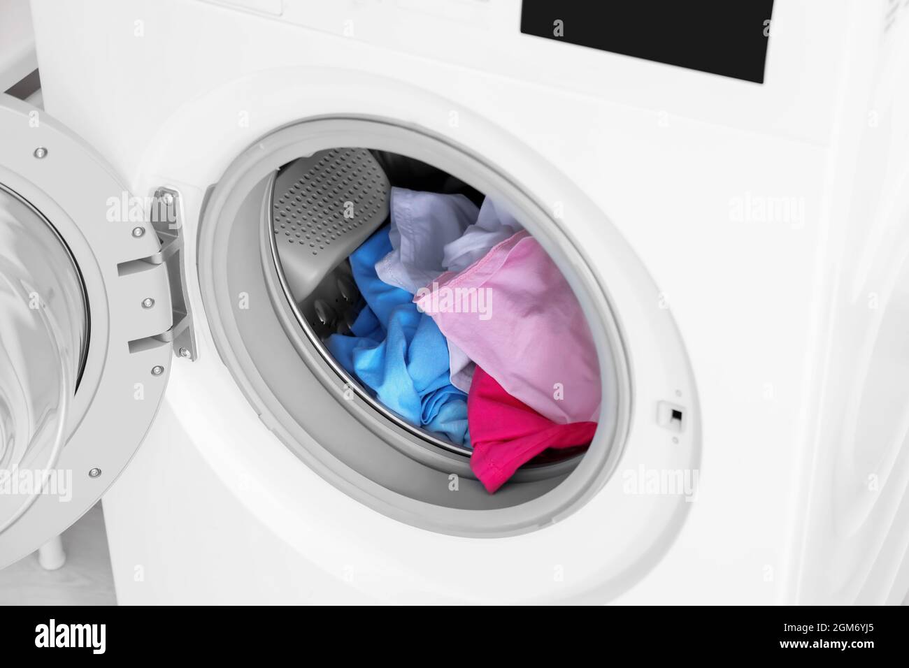 Modern washing machine with laundry, closeup Stock Photo - Alamy
