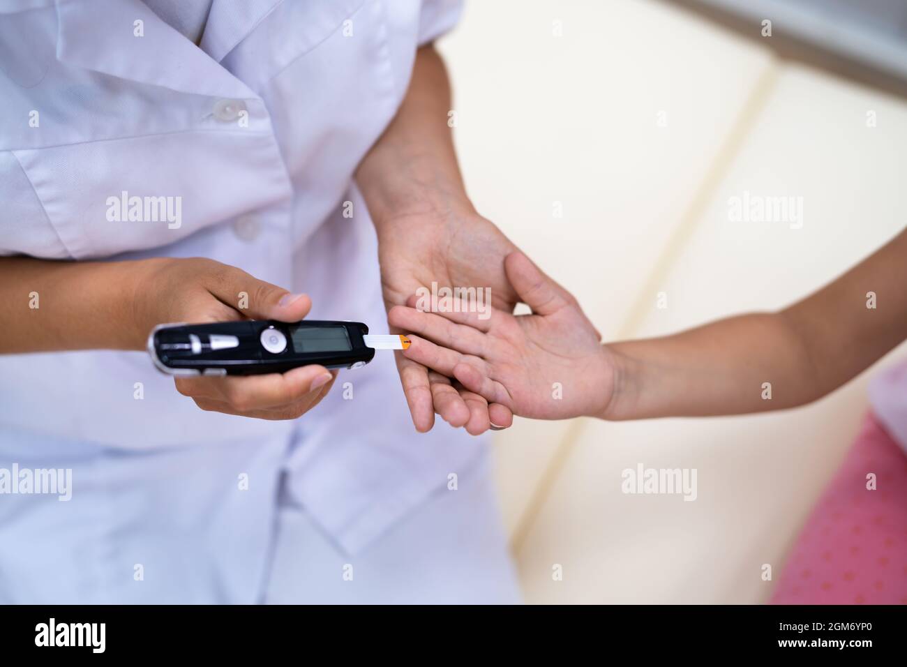 Diabetic Child Blood Sugar Test By Doctor Stock Photo - Alamy