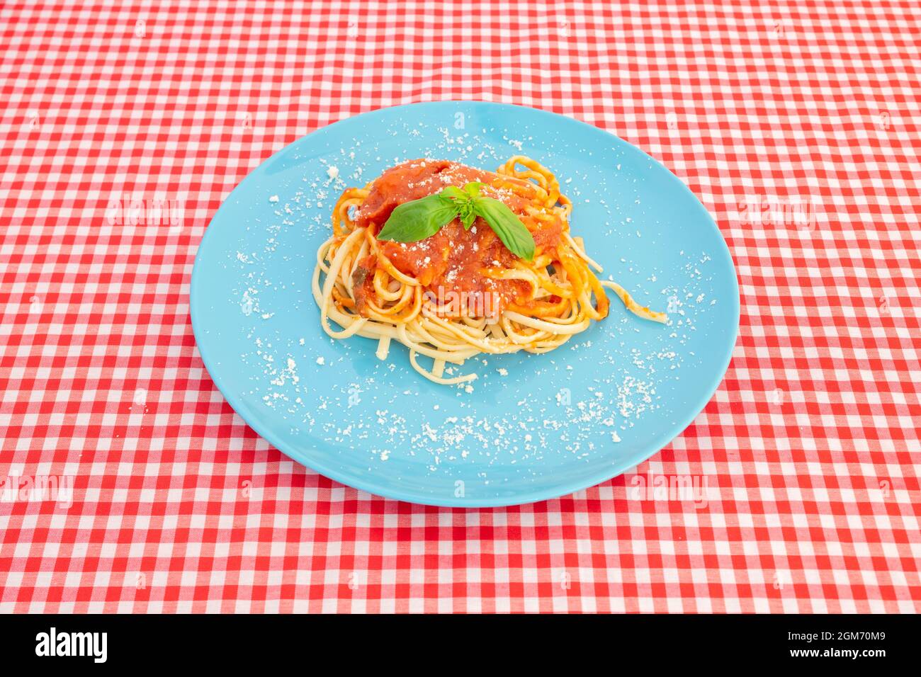 Popular recipe for noodles with bolognese sauce with basil leaves and ...