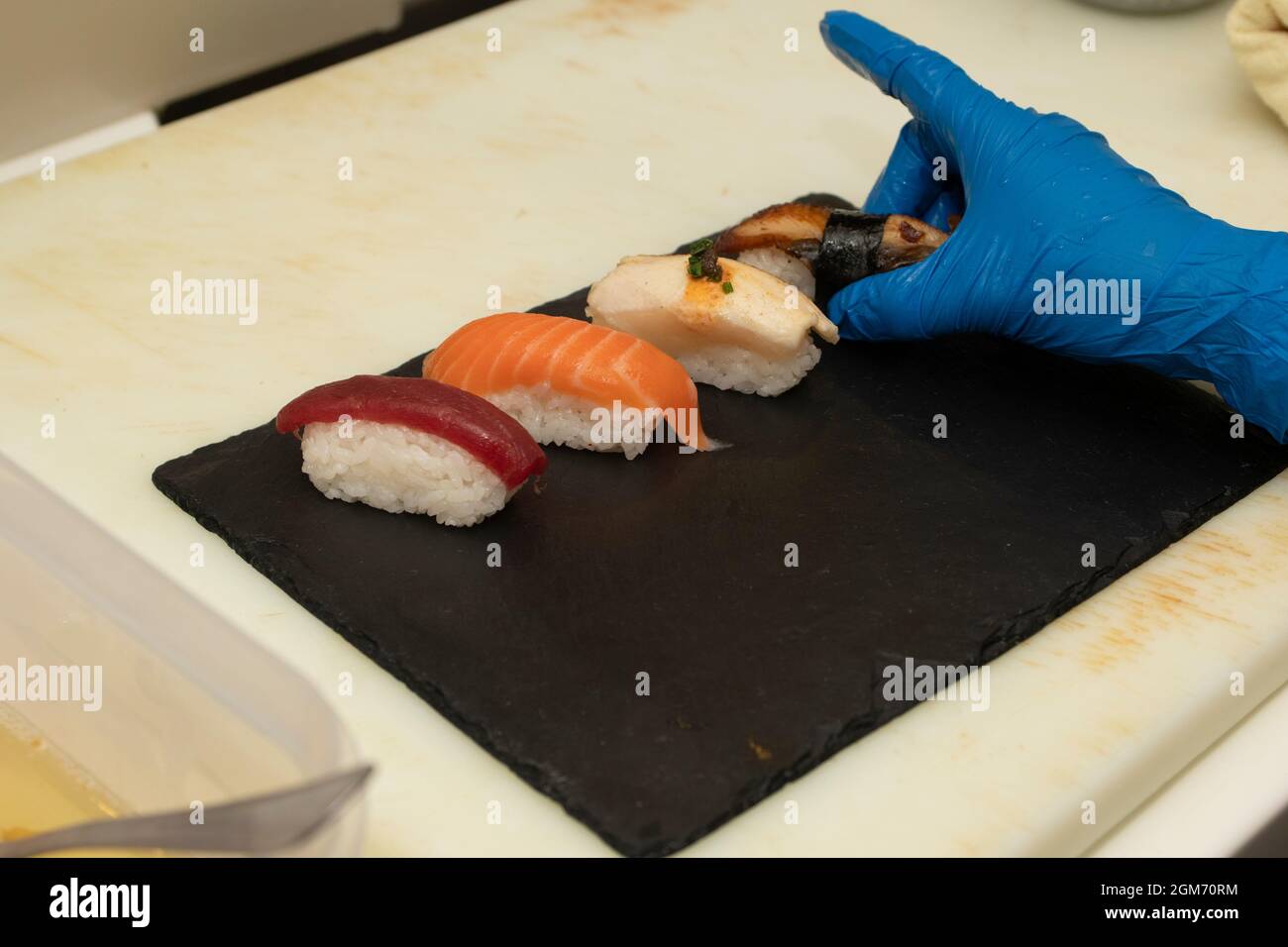 Nigiri sushi tray with pieces of bluefin tuna, Norwegian salmon ...