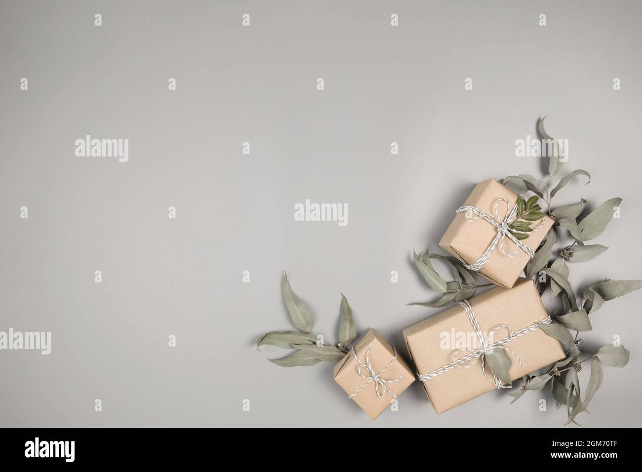 Small gift boxes on solid gray background Stock Photo - Alamy