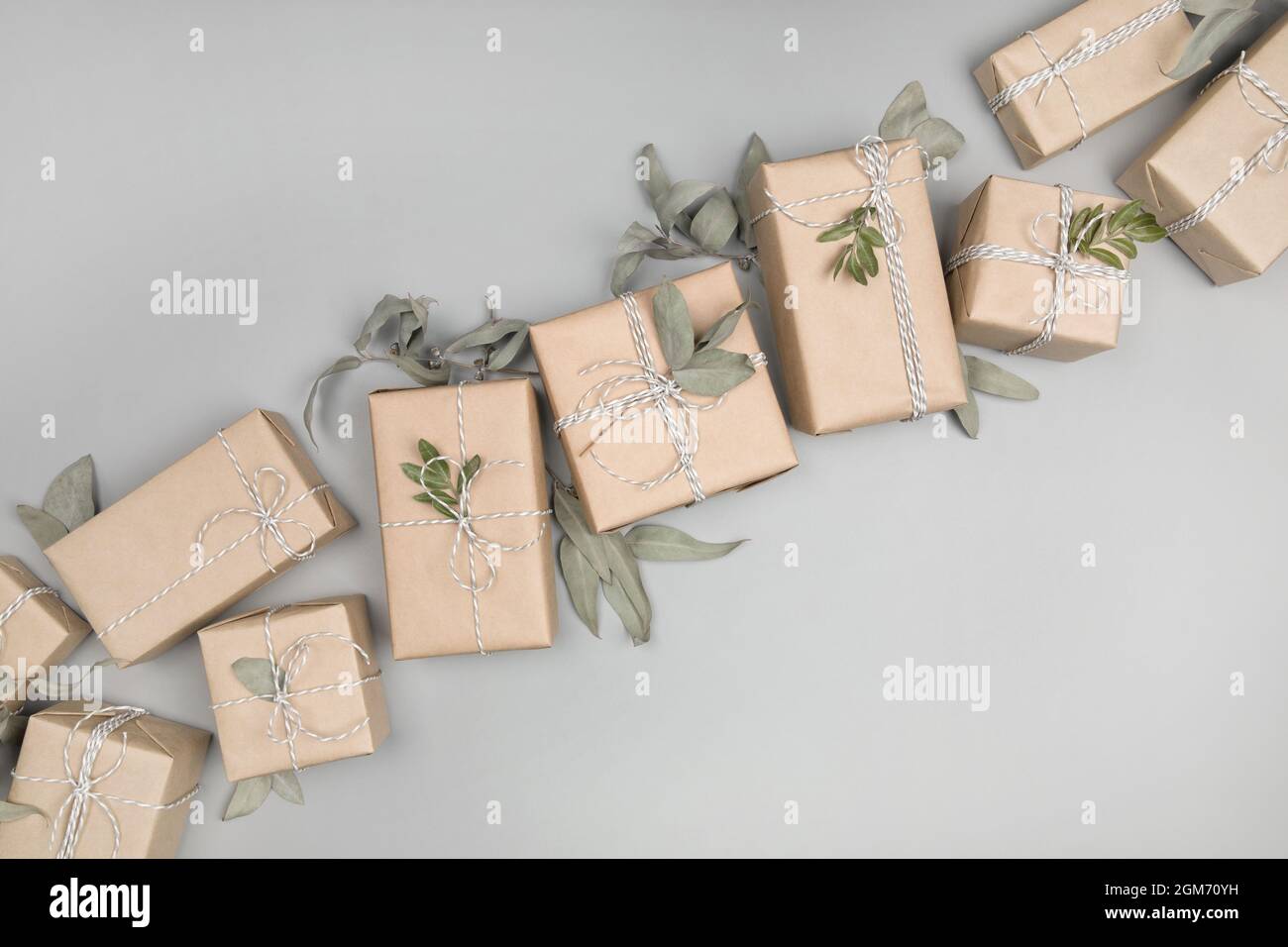 Small gift boxes on solid gray background Stock Photo - Alamy