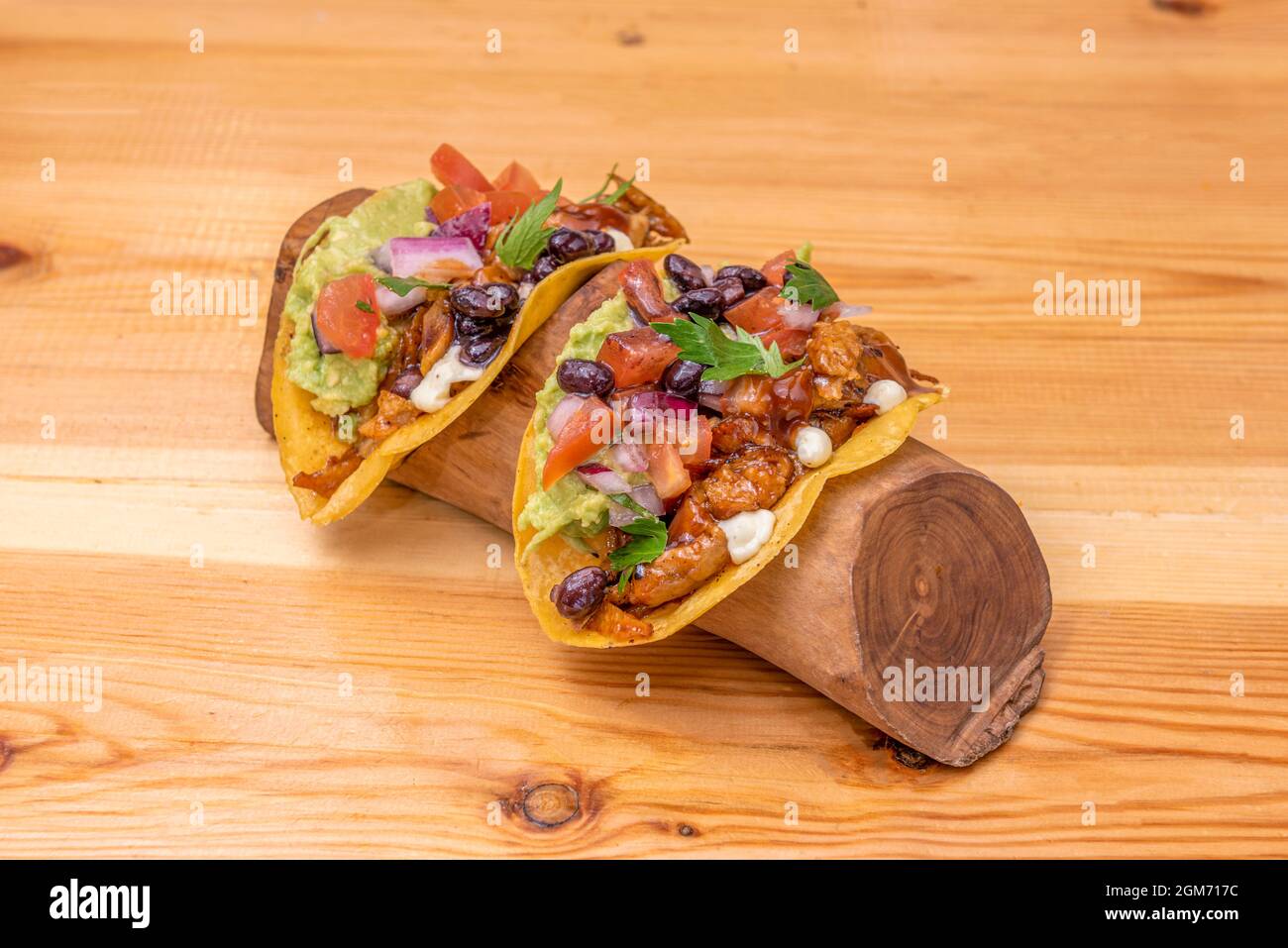 Log-Mounted Mexican Tacos Stuffed Overflowing with Chicken, Guacamole ...