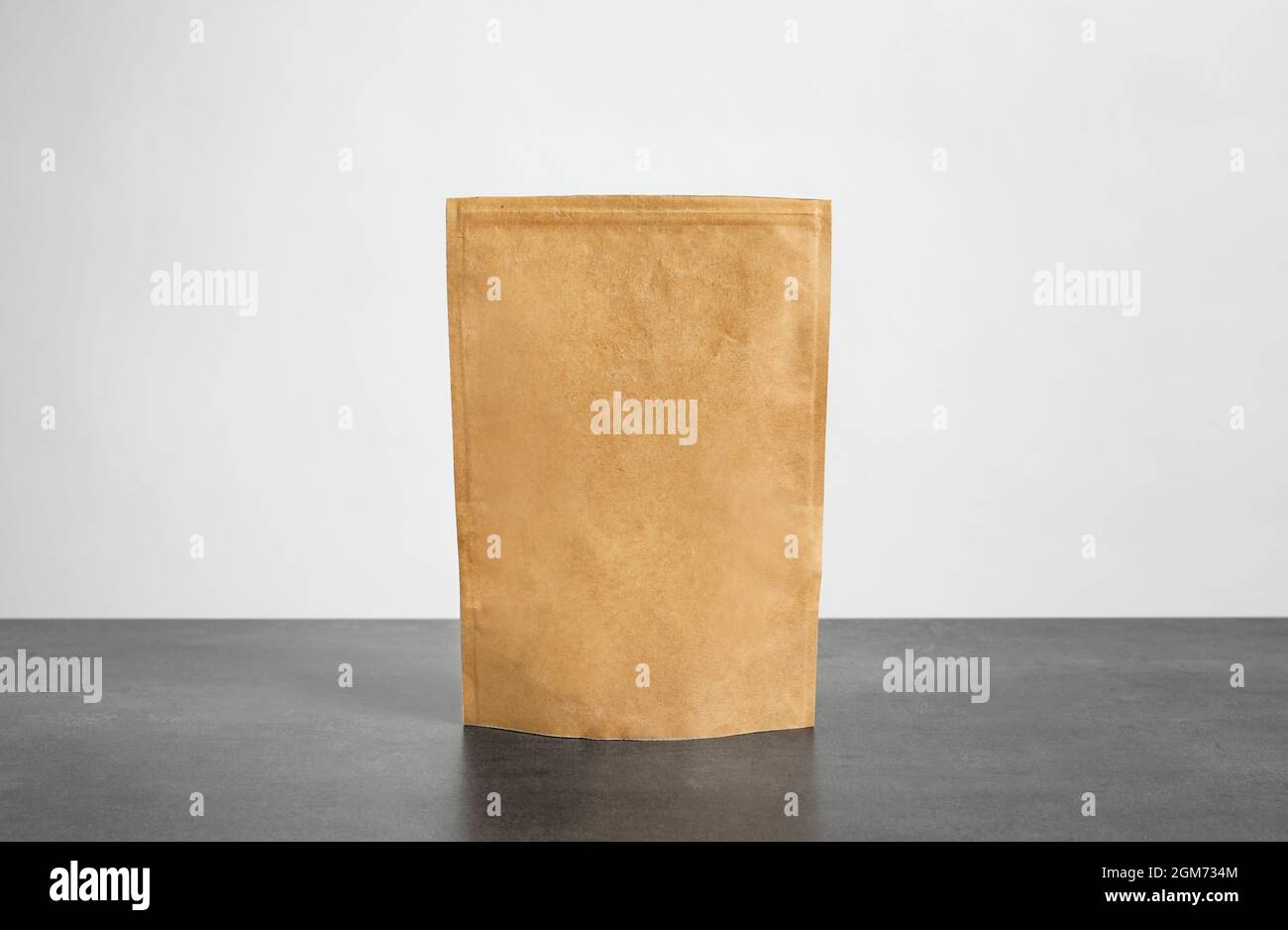 Ziploc paper bag on table against white background. Mockup for design ...