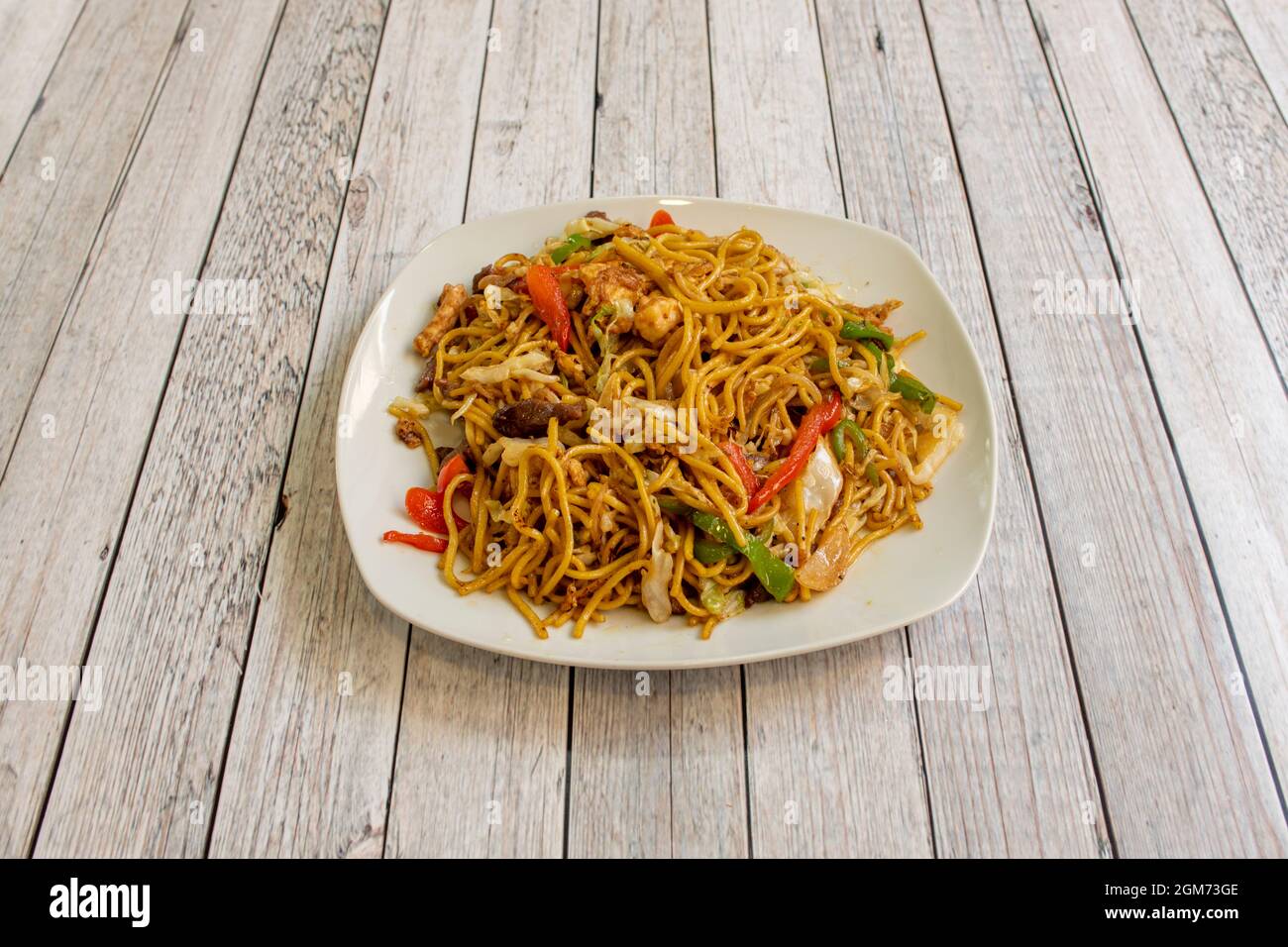 Chinese fine noodles sauteed with vegetables three delicacies and soy ...