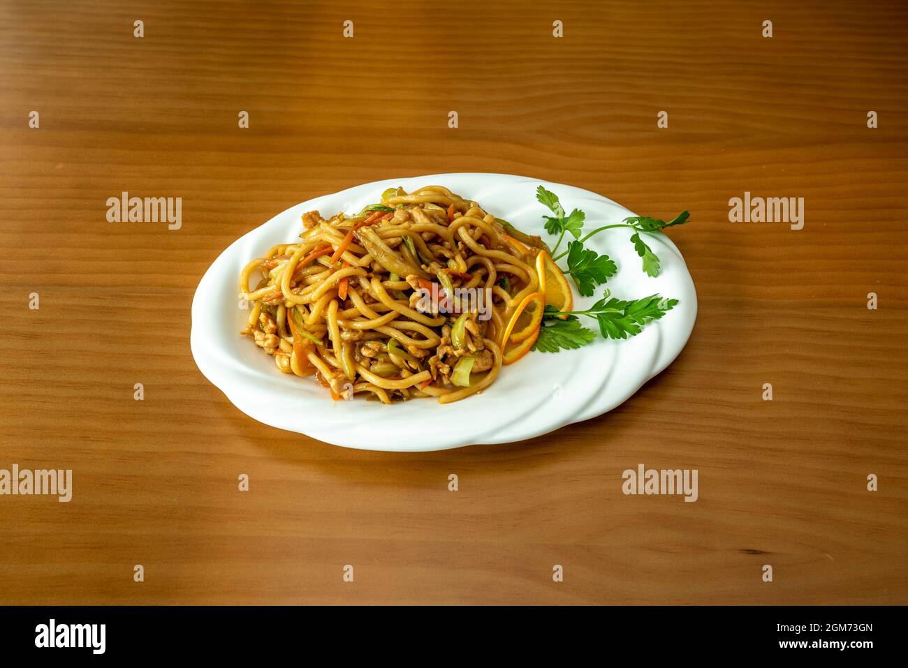 Asian udon noodles with hot sauce, sauteed fruits, vegetables and ...